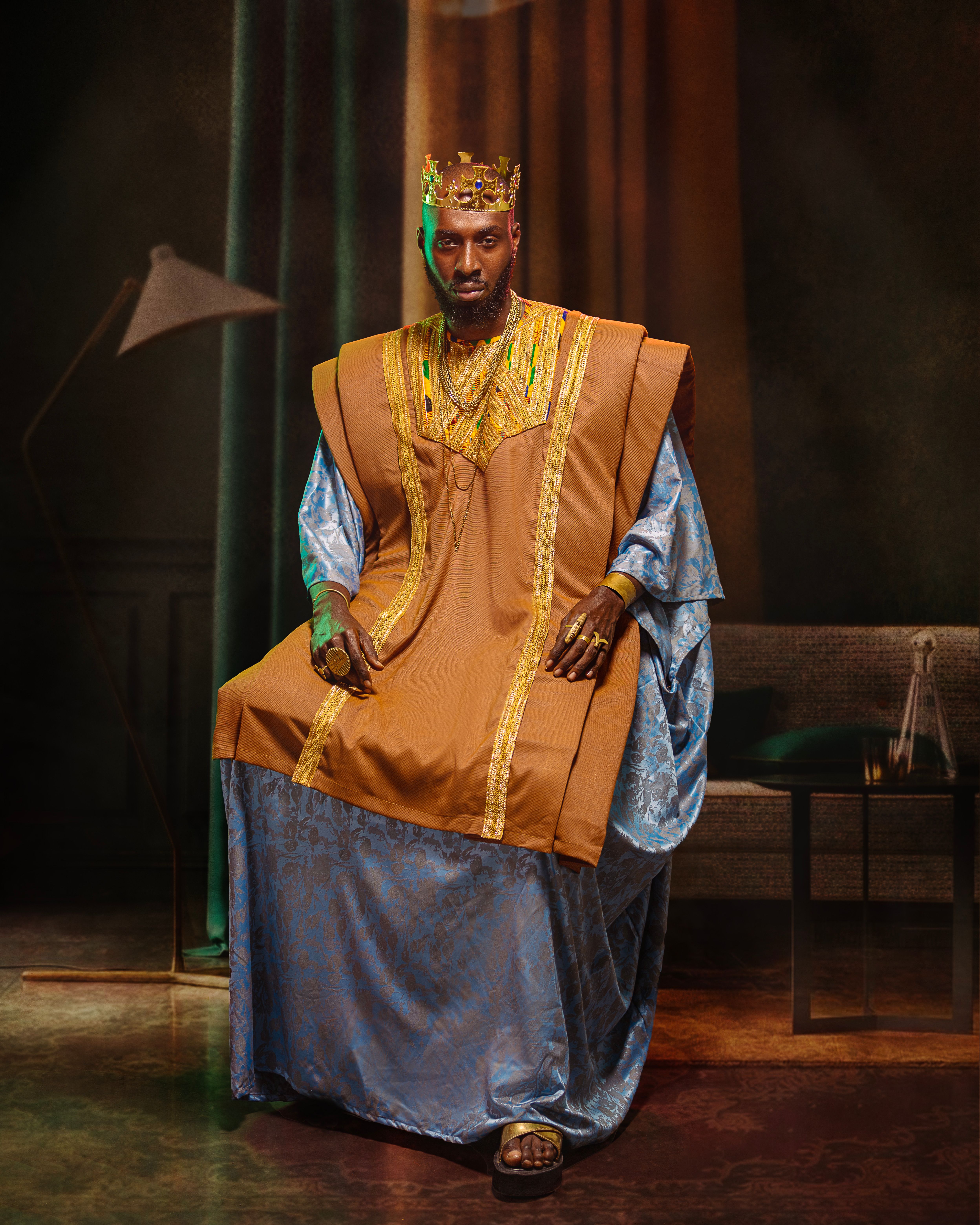Man Sitting in Crown and Traditional Clothing · Free Stock Photo