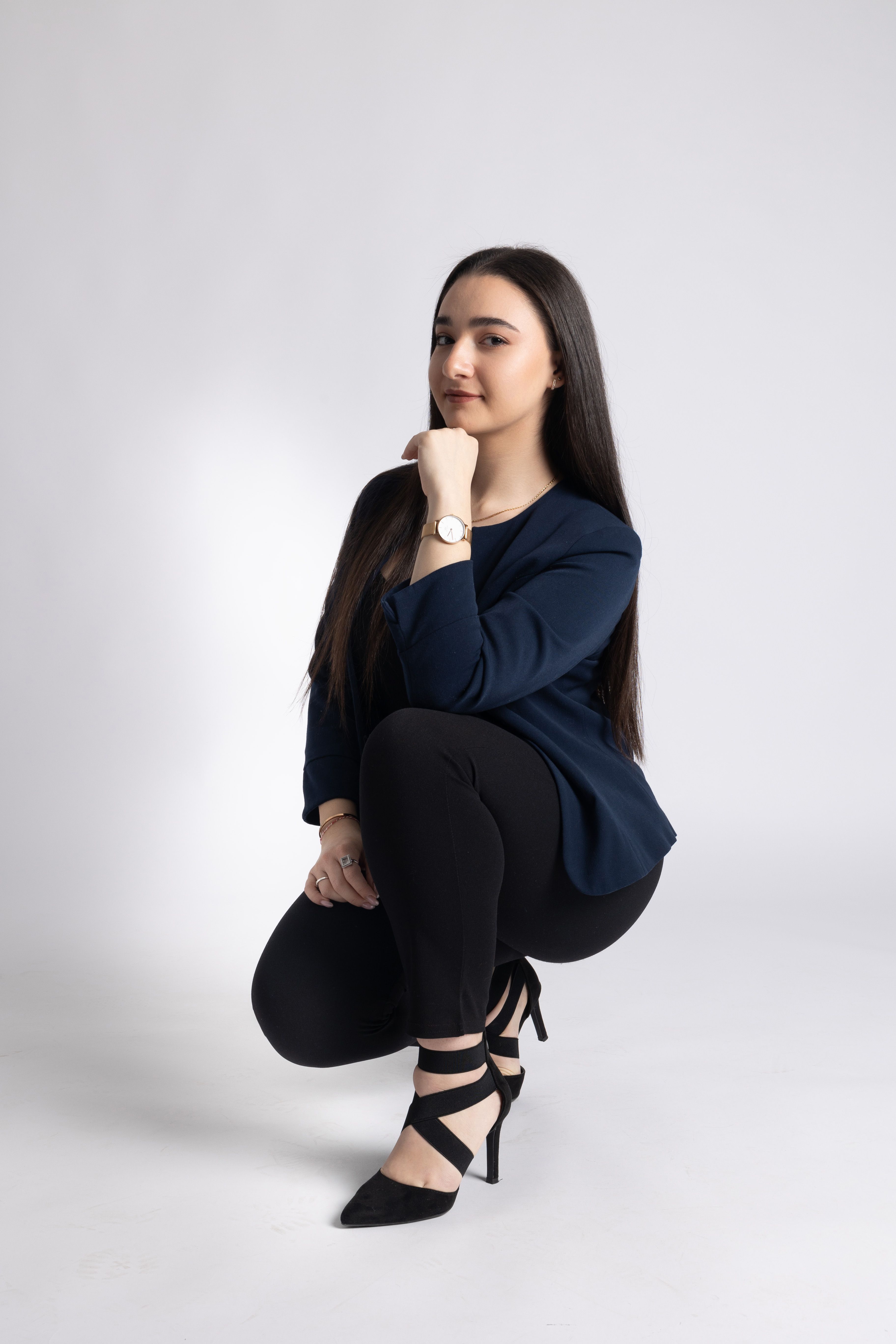 Woman Crouching in High Heels · Free Stock Photo