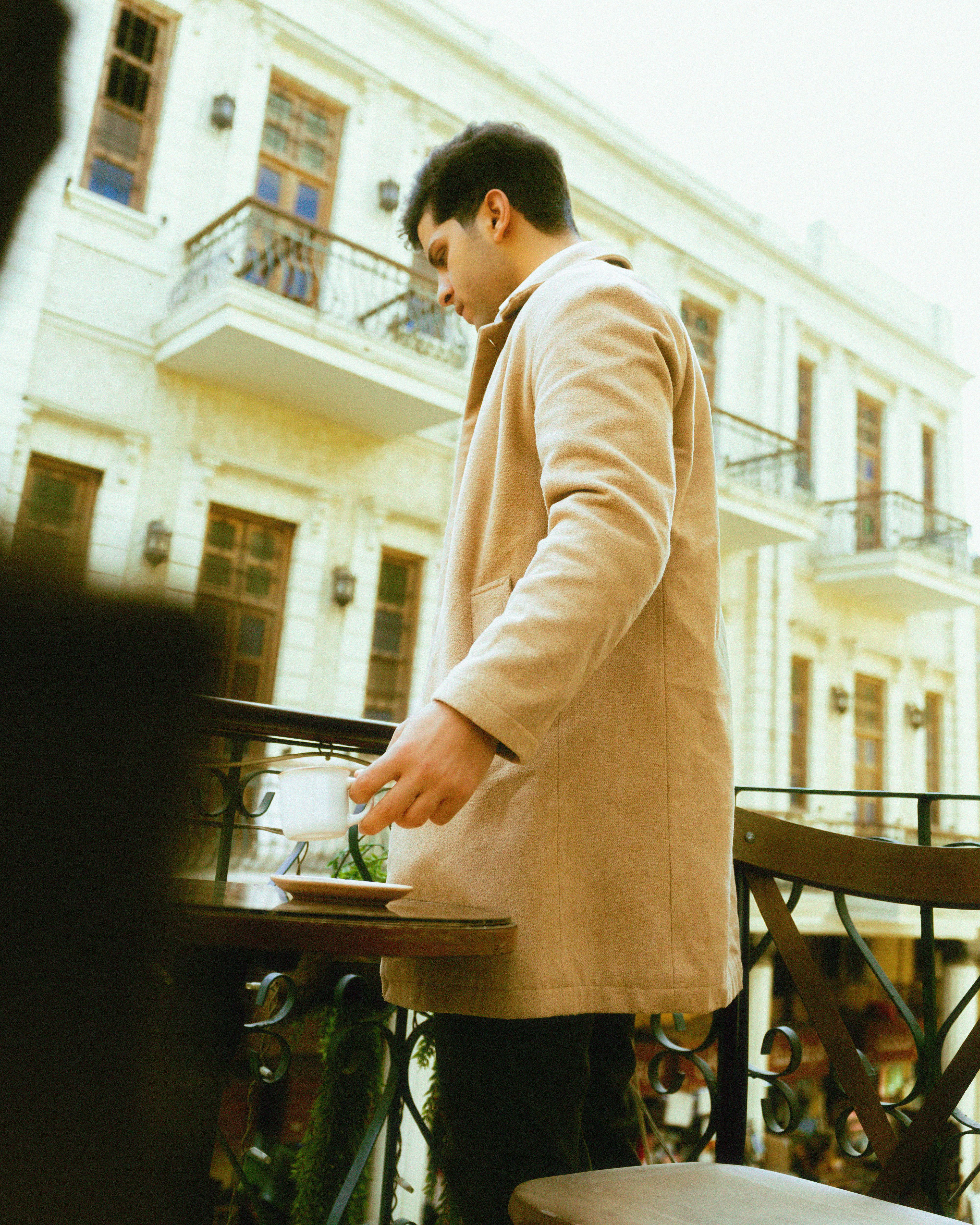 Man Sepia Coat at Cafe Patio · Free Stock Photo
