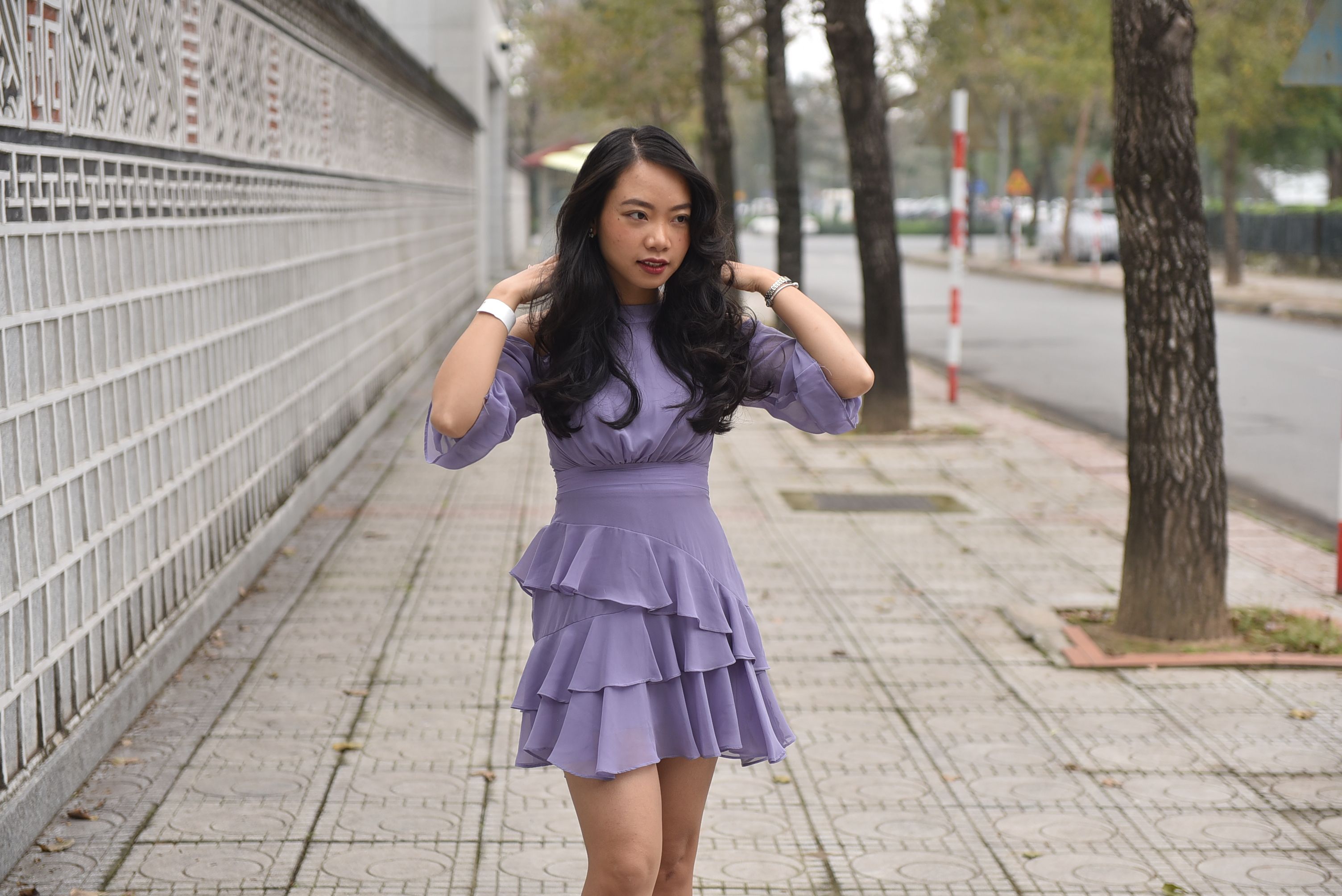 Young Brunette in Lilac Dress with Ruffles · Free Stock Photo