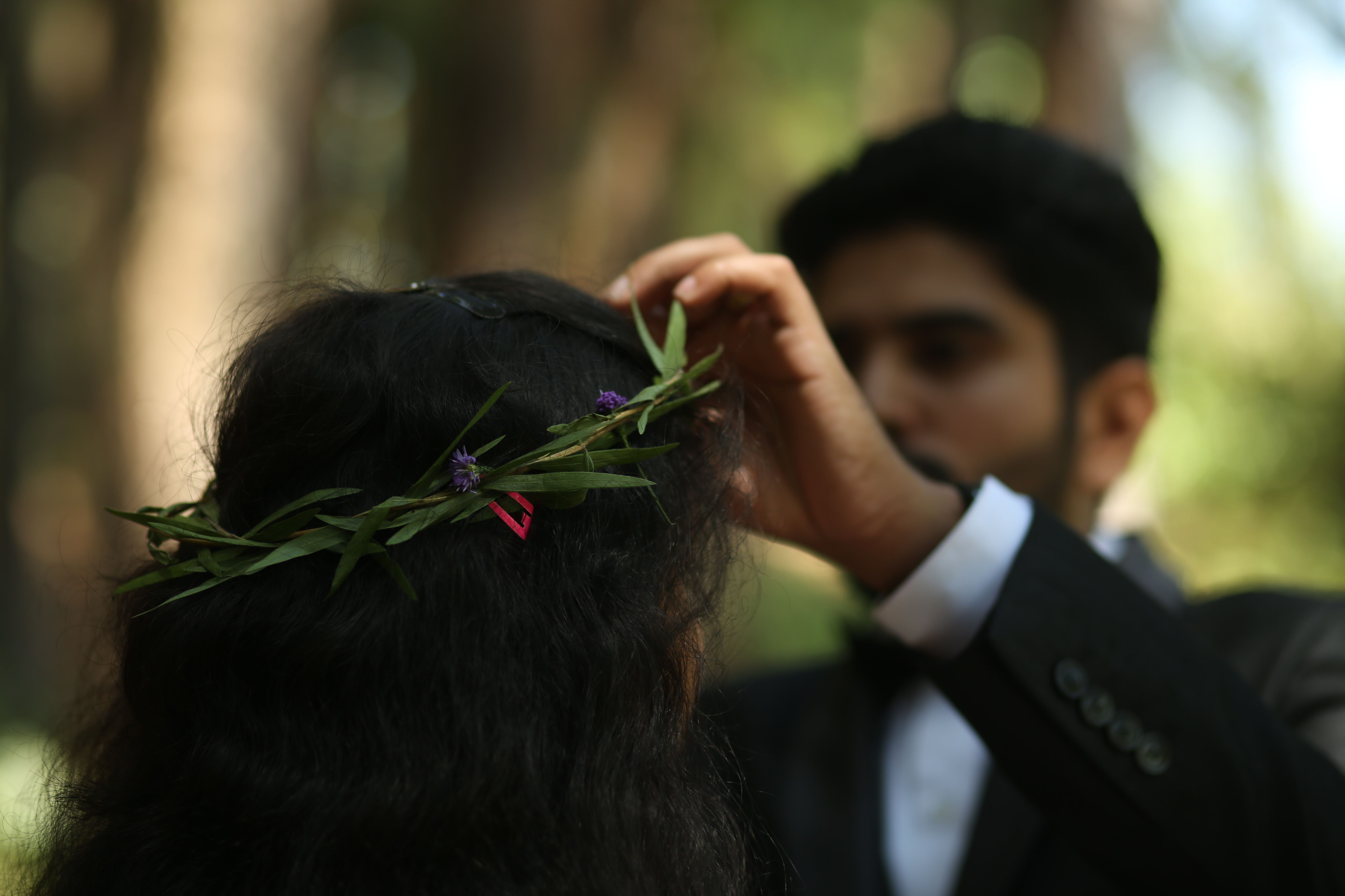Man Putting Leaved Wreath on Woman Head · Free Stock Photo