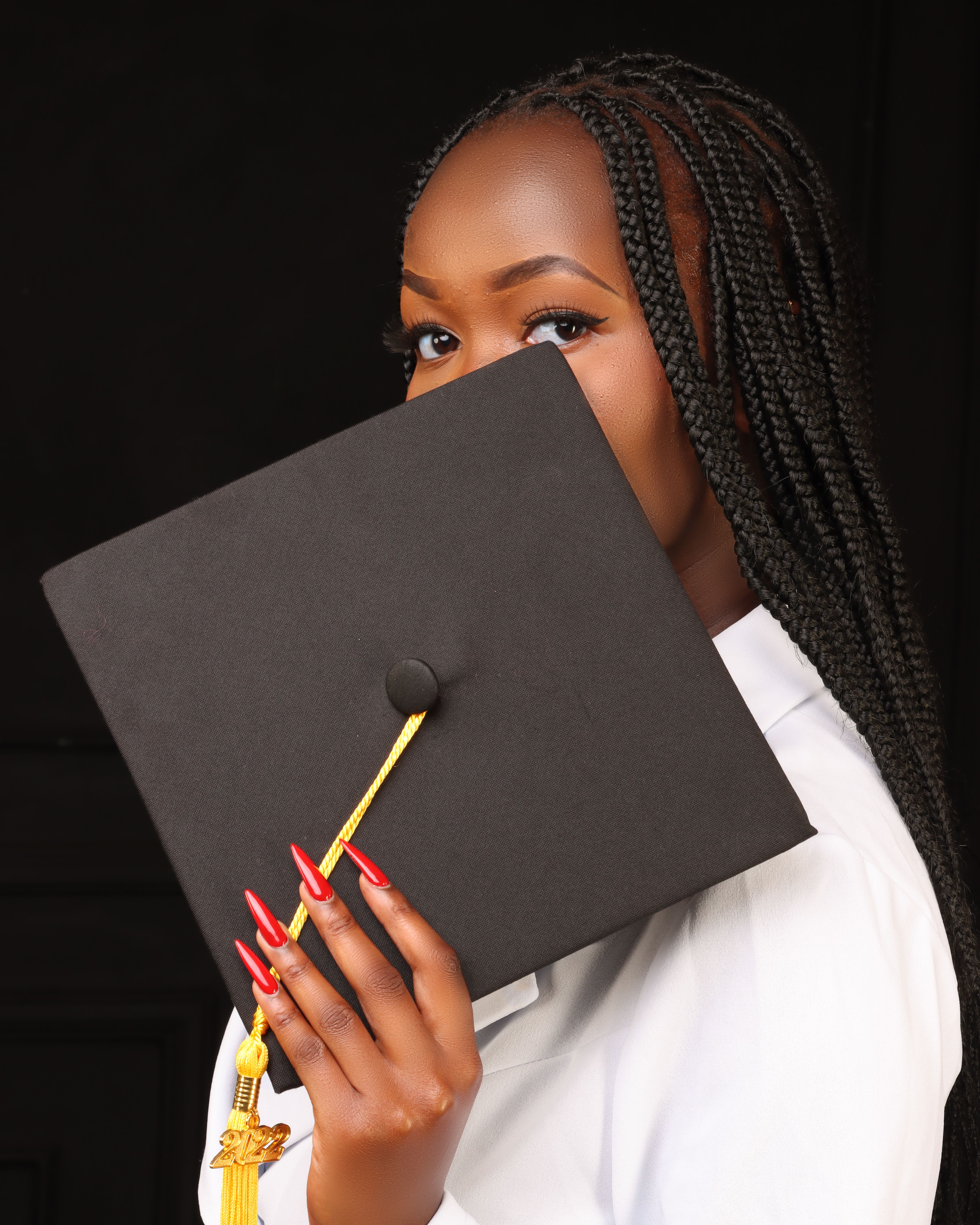 Close-Up Shot of a Person Holding Square Academic Cap and Diploma ...
