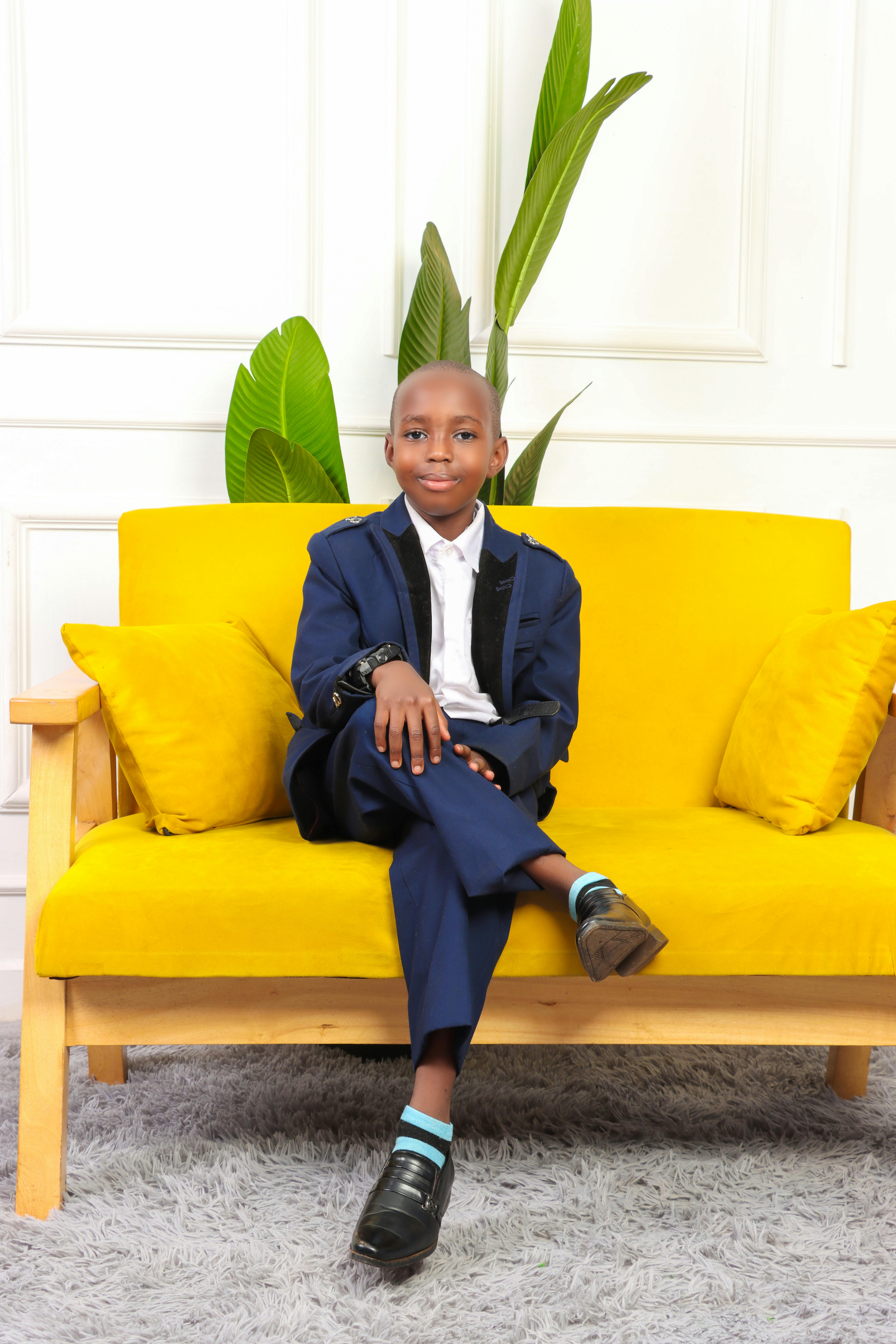 Boy Sitting on a Sofa · Free Stock Photo