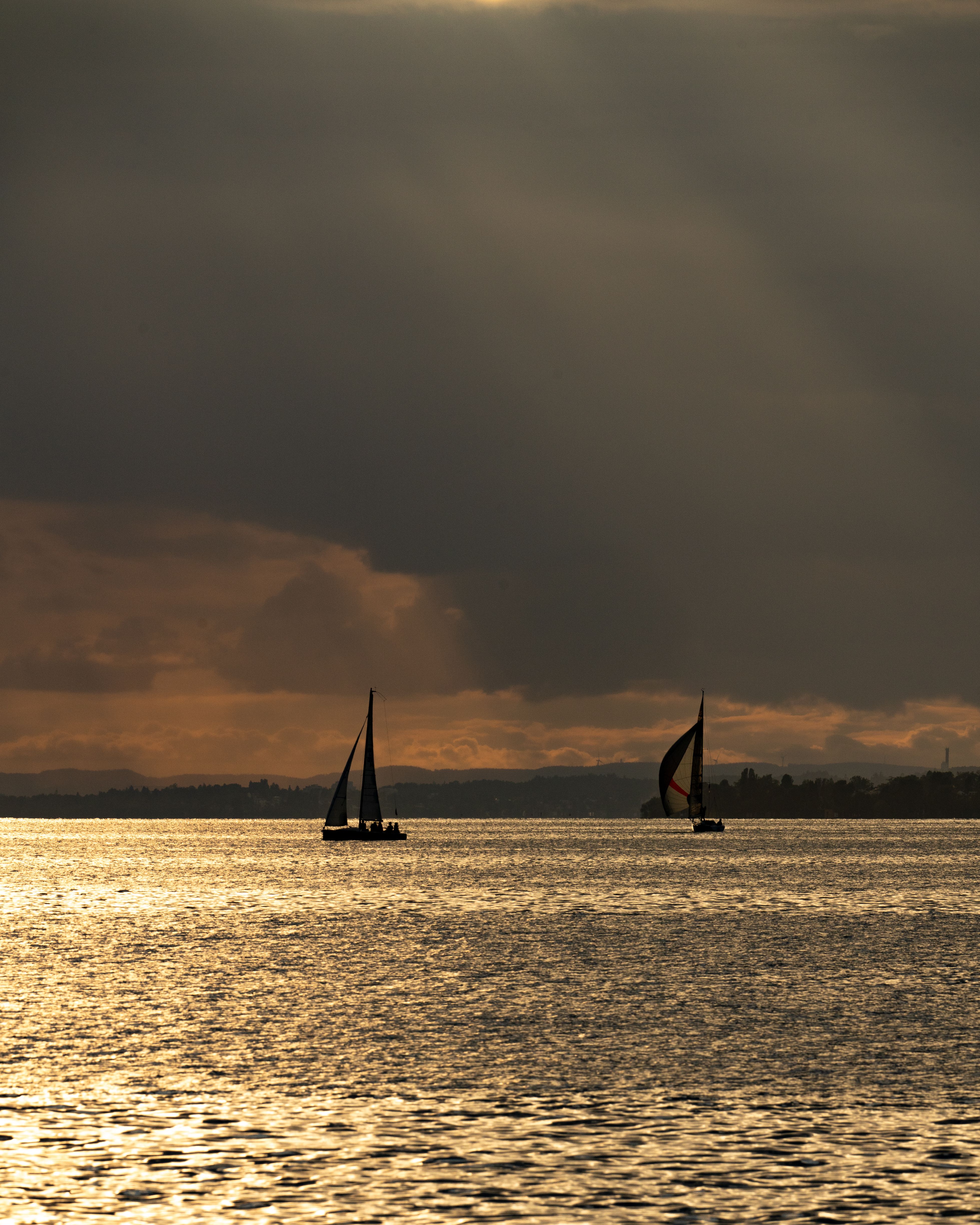 Sailboats under Rain Cloud at Sunset · Free Stock Photo