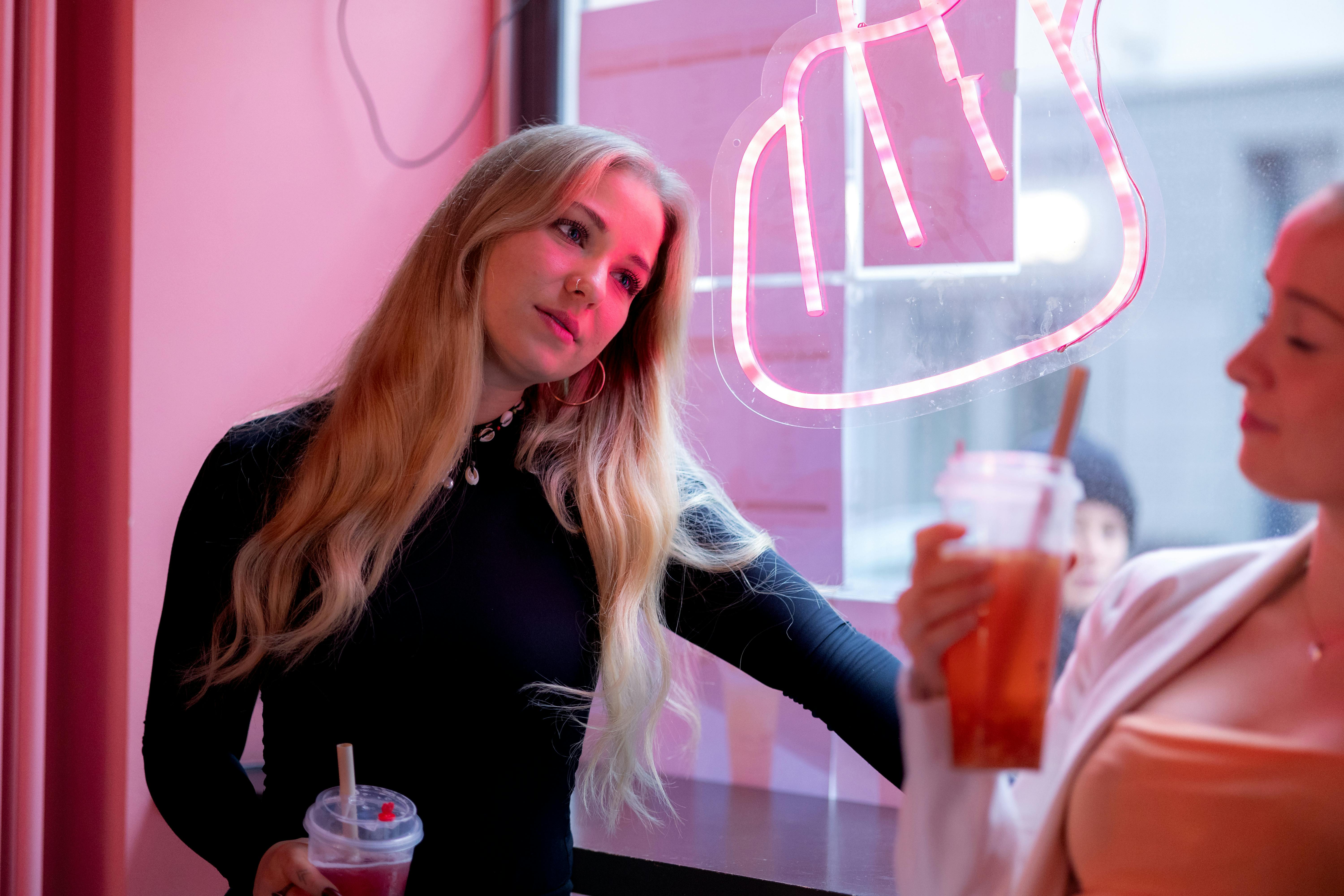 Blonde Woman by Window with Neon · Free Stock Photo