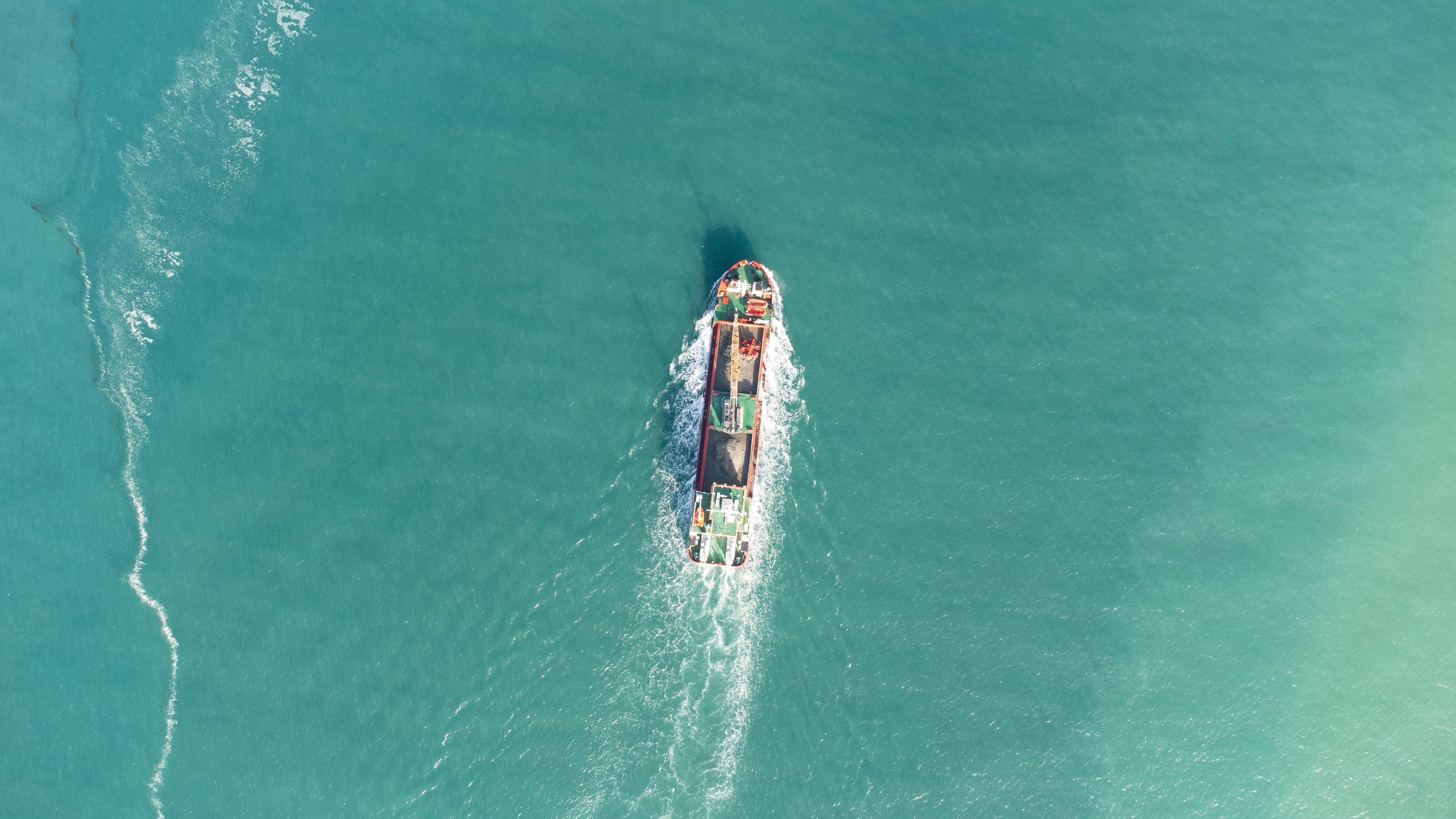 Top View Photo Of Boat On Sea · Free Stock Photo