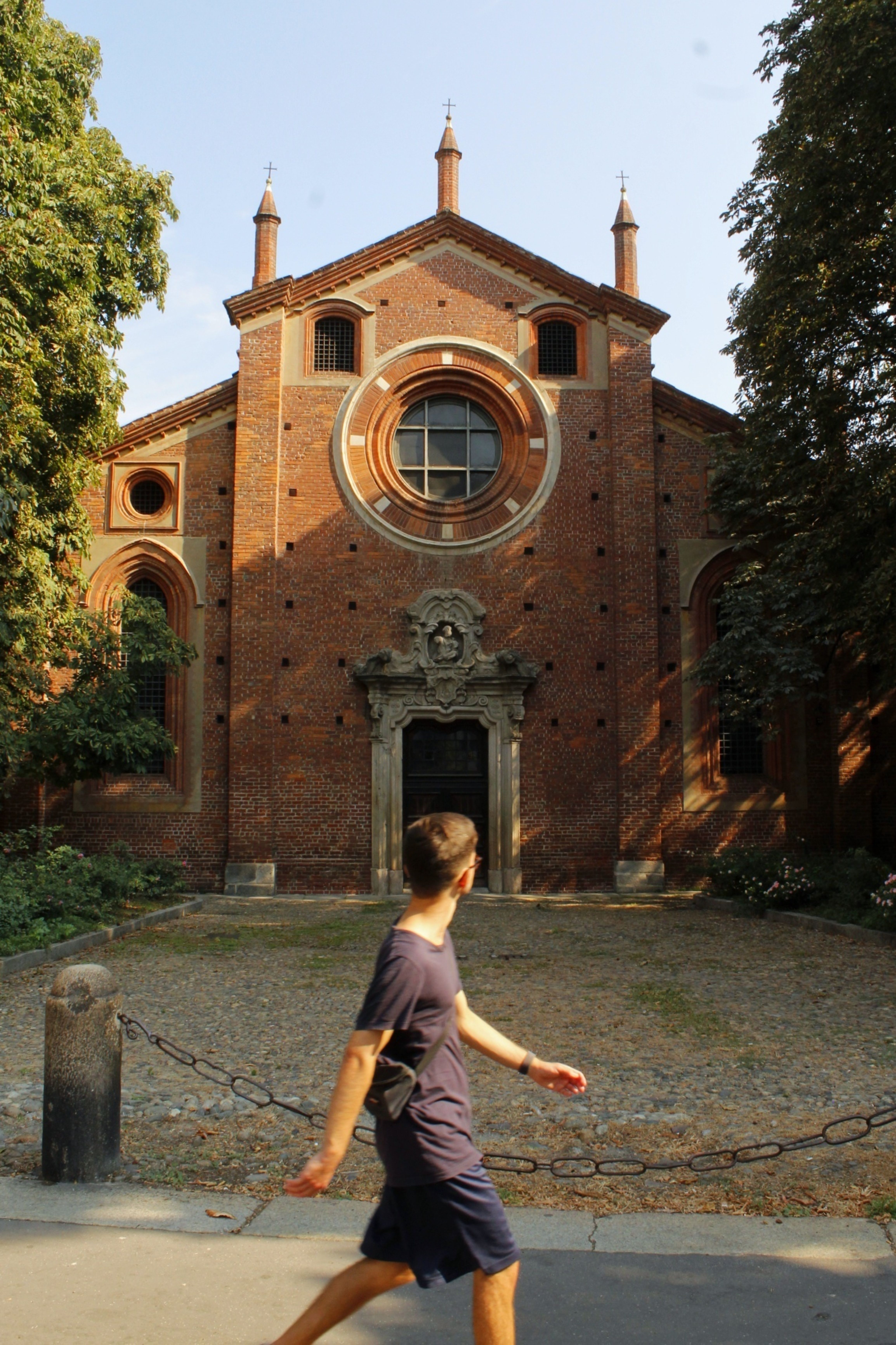Man Walking by Church of San Pietro in Gessate · Free Stock Photo