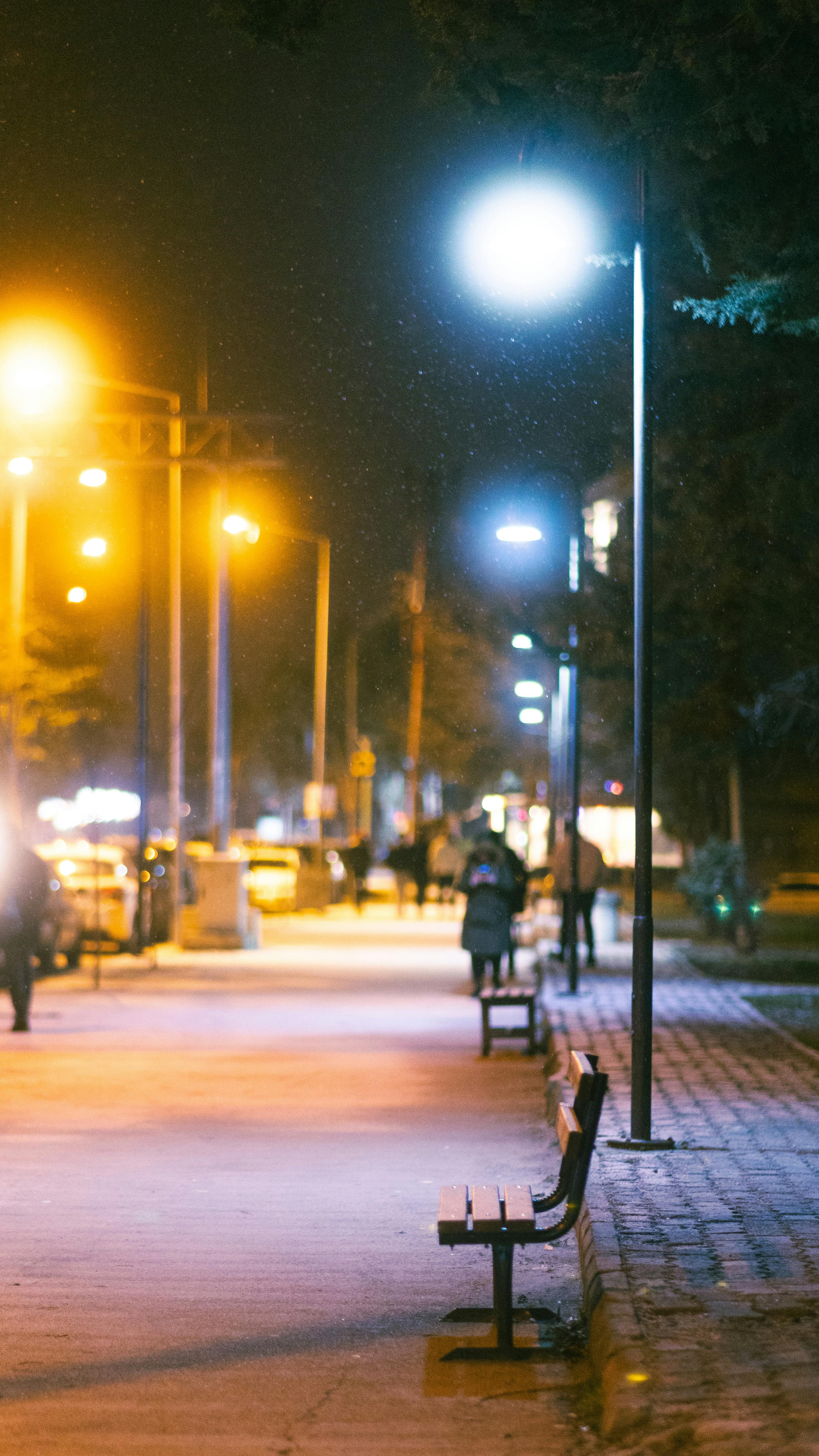 Pedestrians Walking on a Street in City at Night · Free Stock Photo