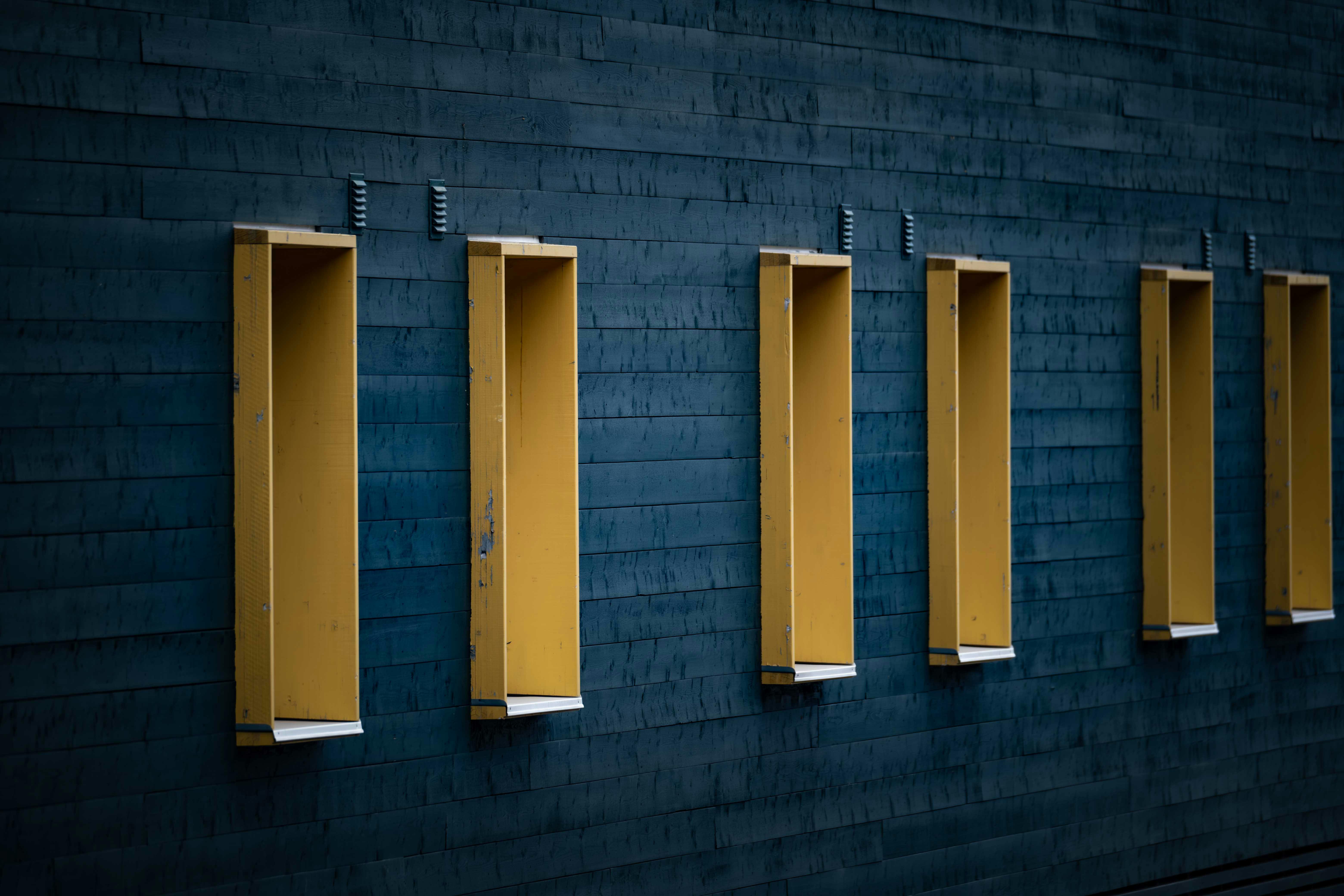 Blue Wall of Brick Building with Windows · Free Stock Photo