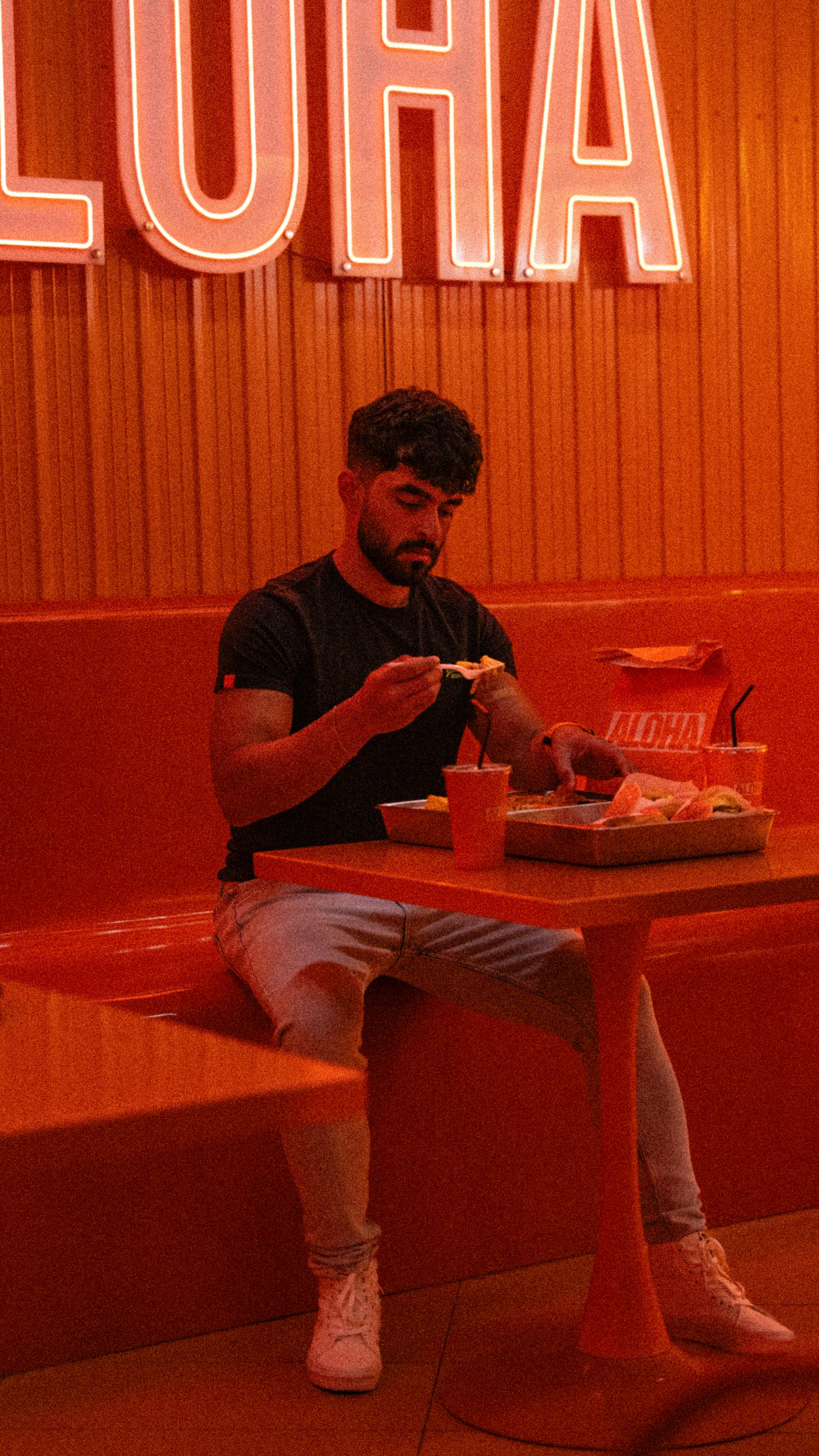 Man Eating Fast Food in a Restaurant · Free Stock Photo