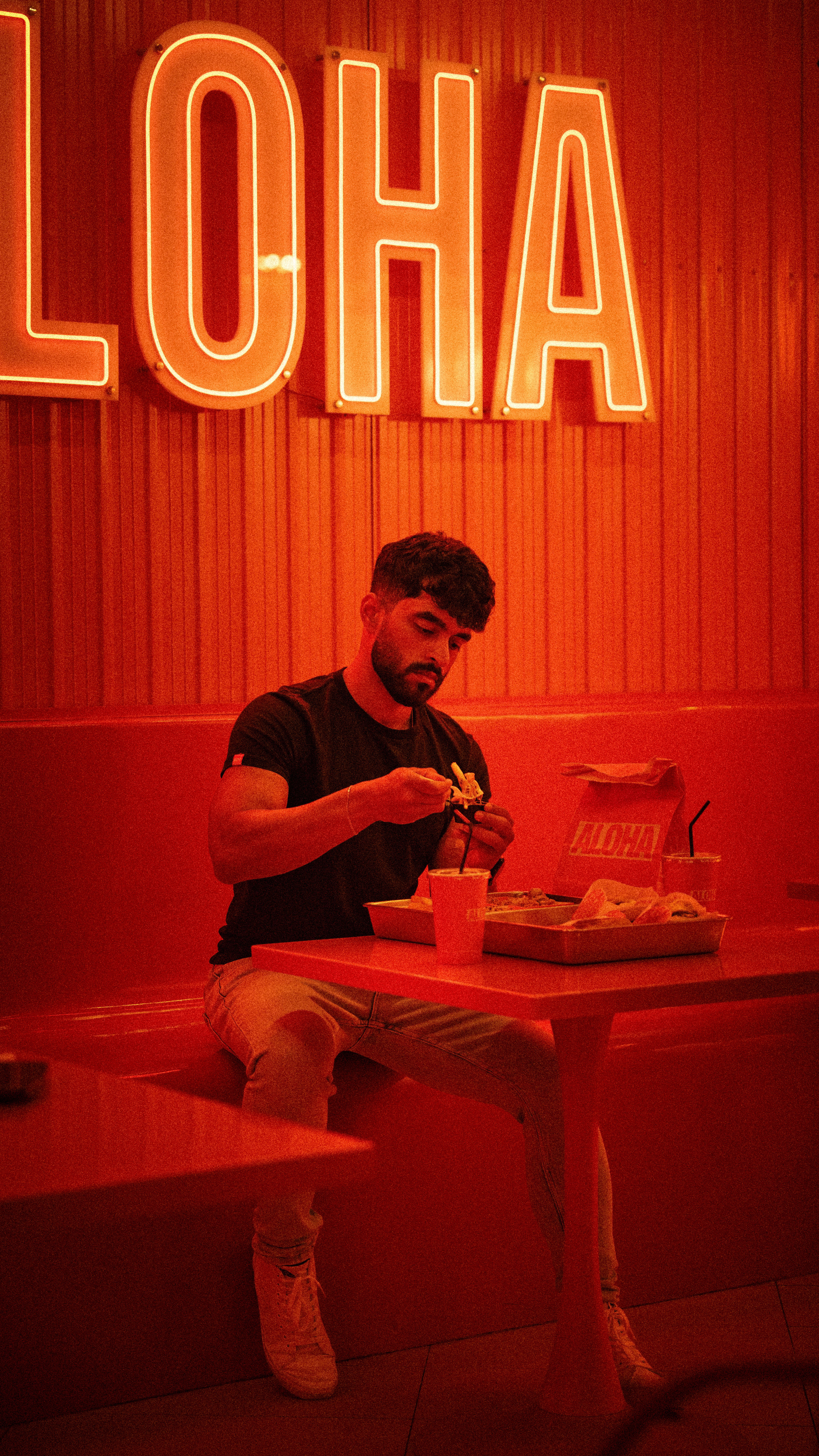 Man Eating Fast Food in a Restaurant · Free Stock Photo