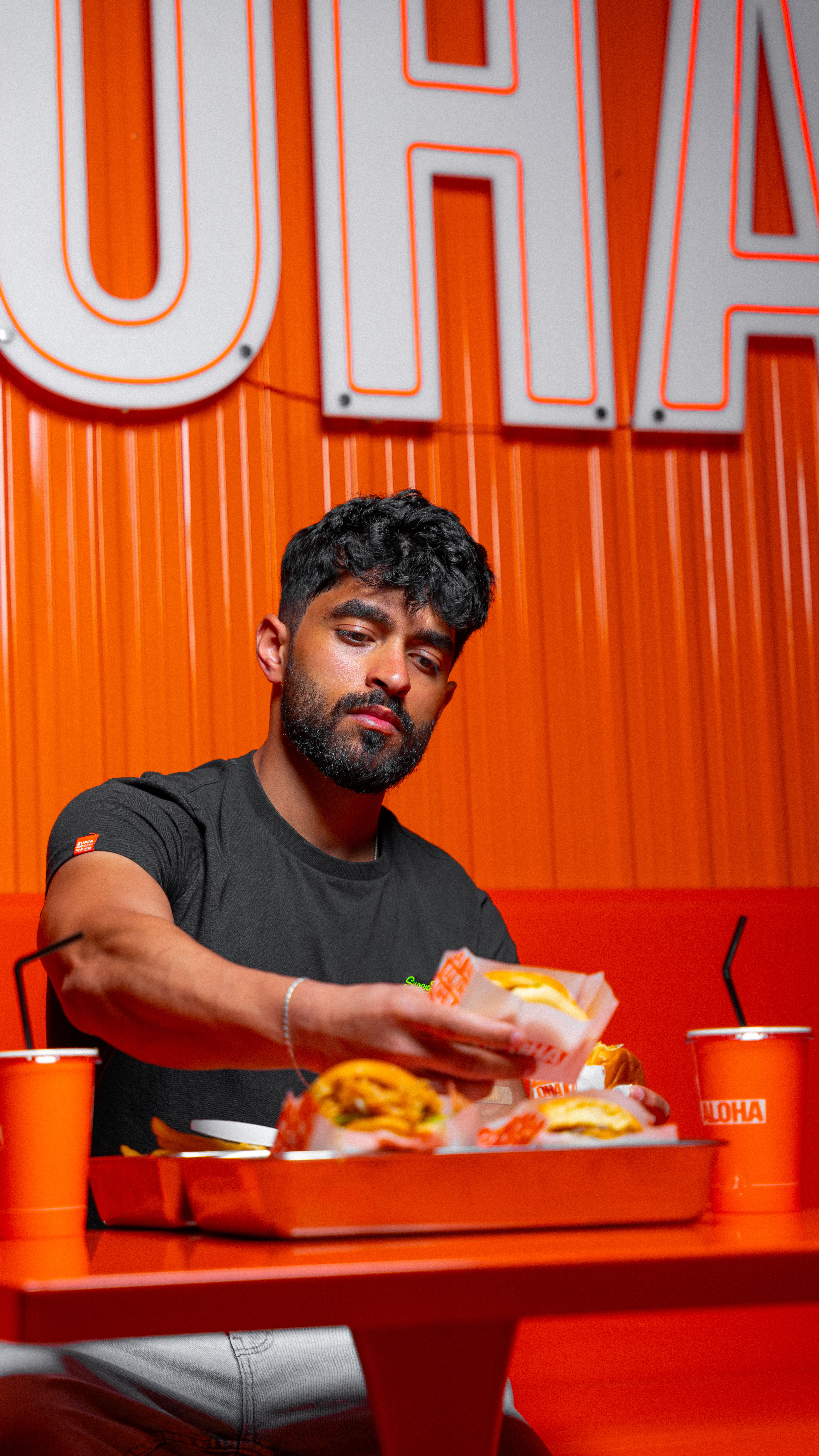 Man Eating Fast Food in a Restaurant · Free Stock Photo