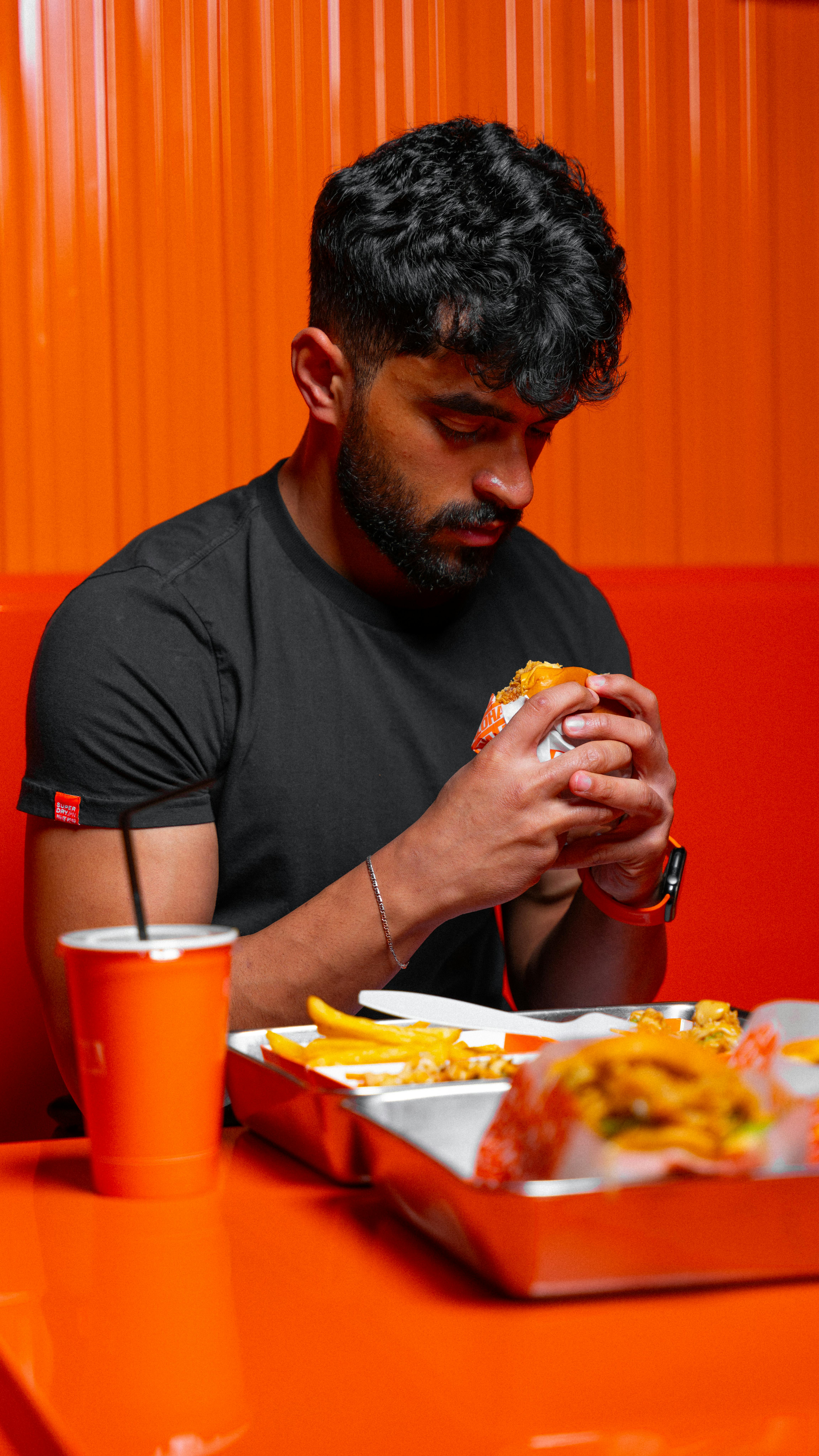 Man Eating Fast Food · Free Stock Photo