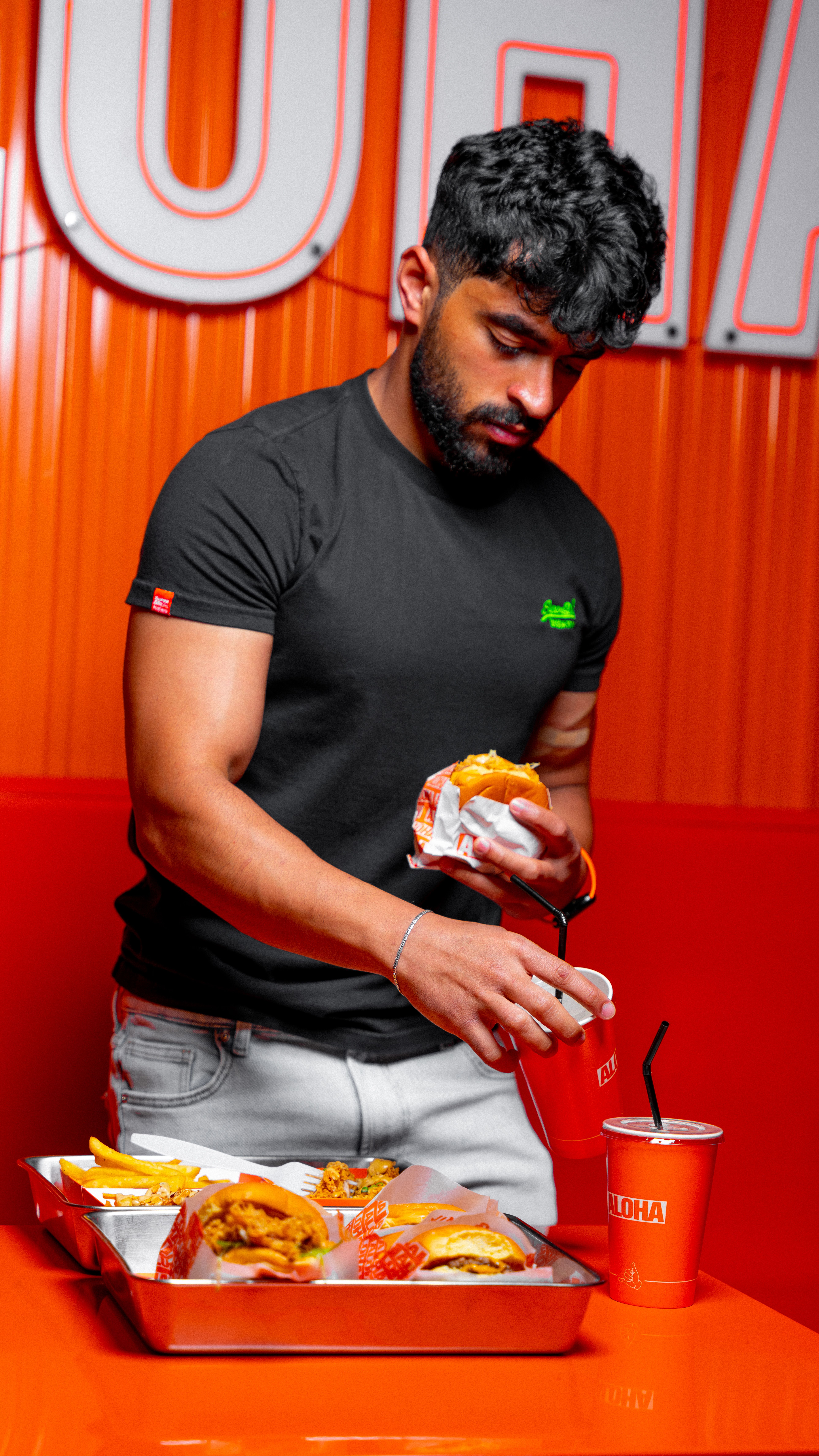 Man Eating Fast Food in a Restaurant · Free Stock Photo