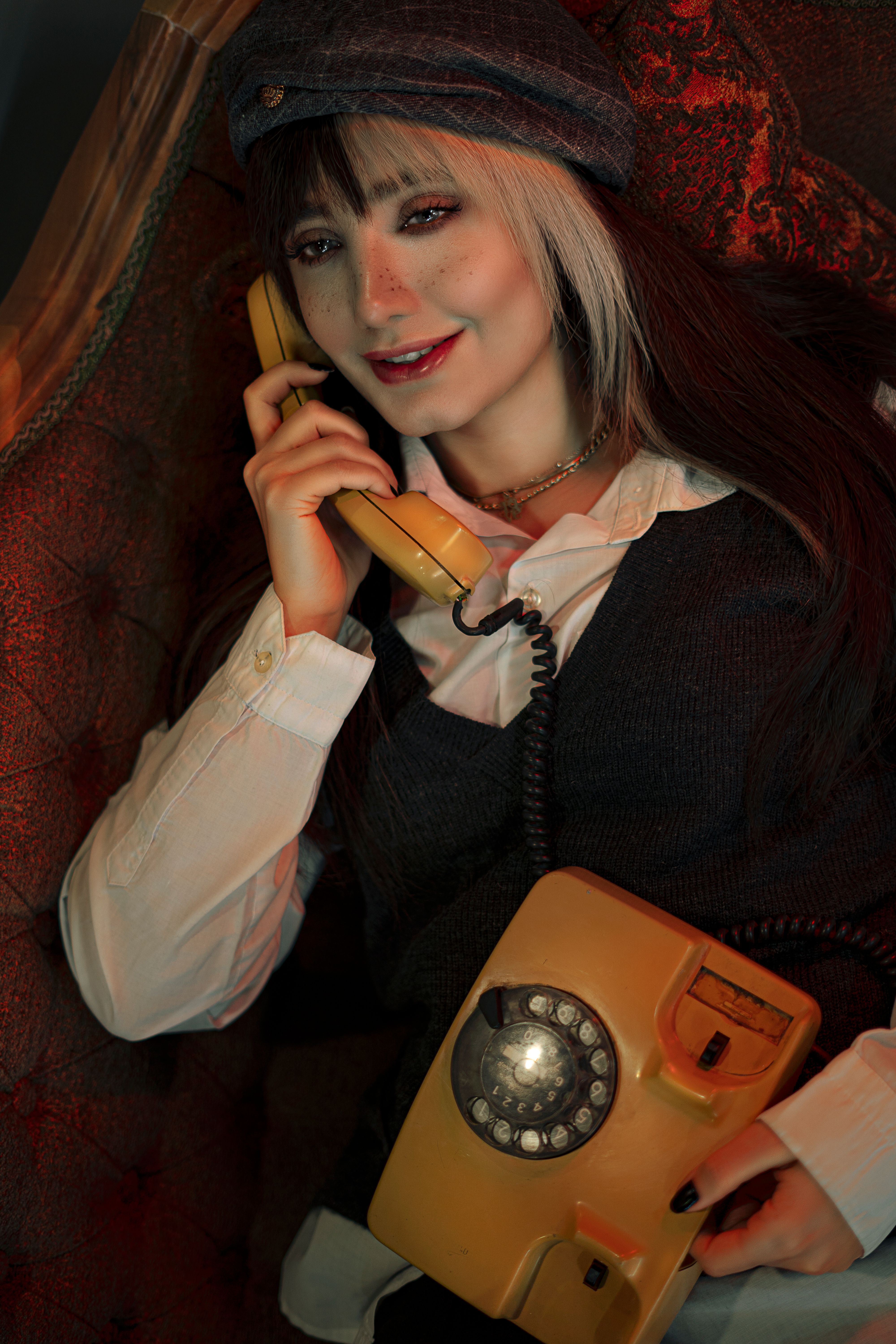 Woman Makes Call on Vintage Telephone · Free Stock Photo