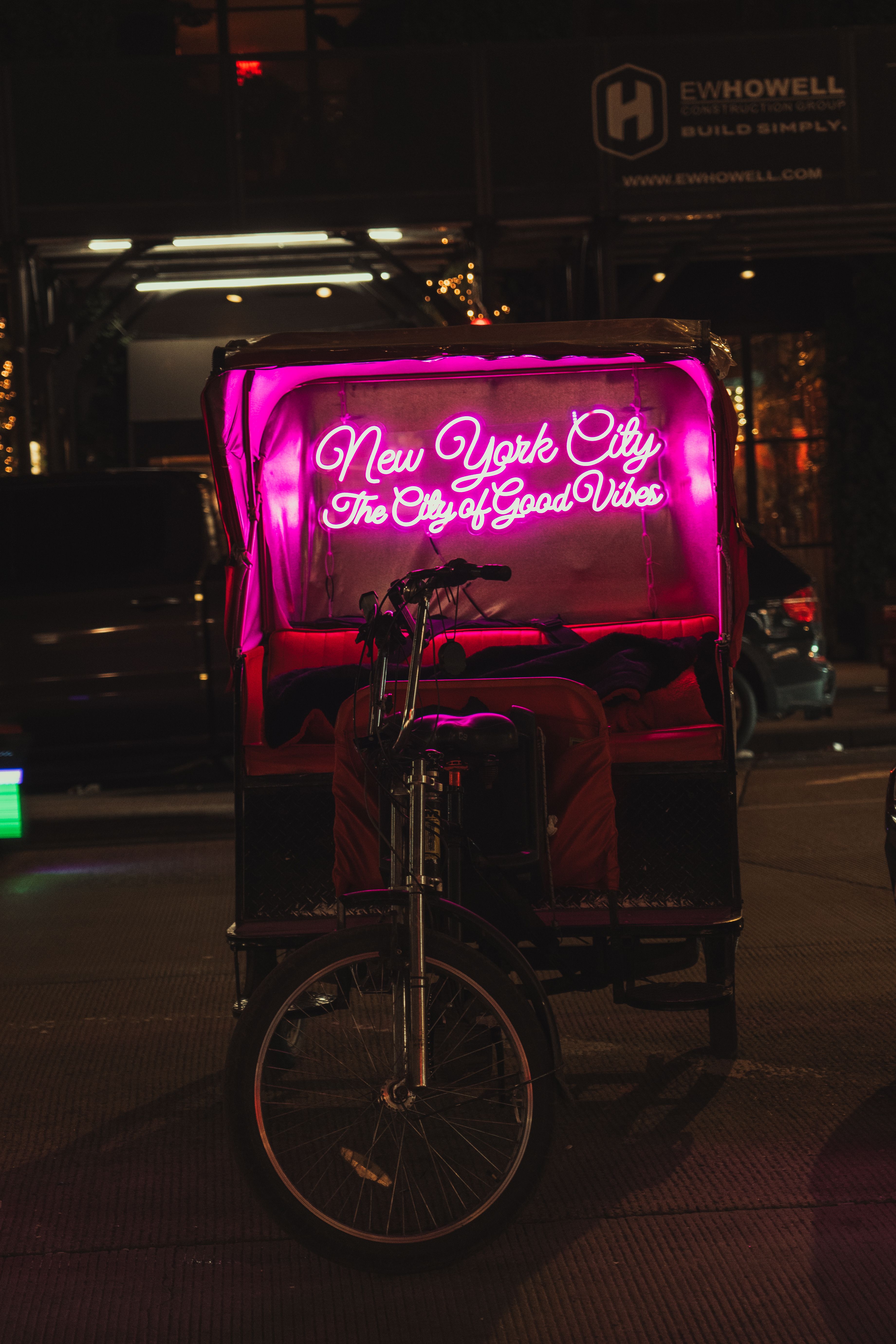 A neon sign on a rickshaw that says new york city · Free Stock Photo