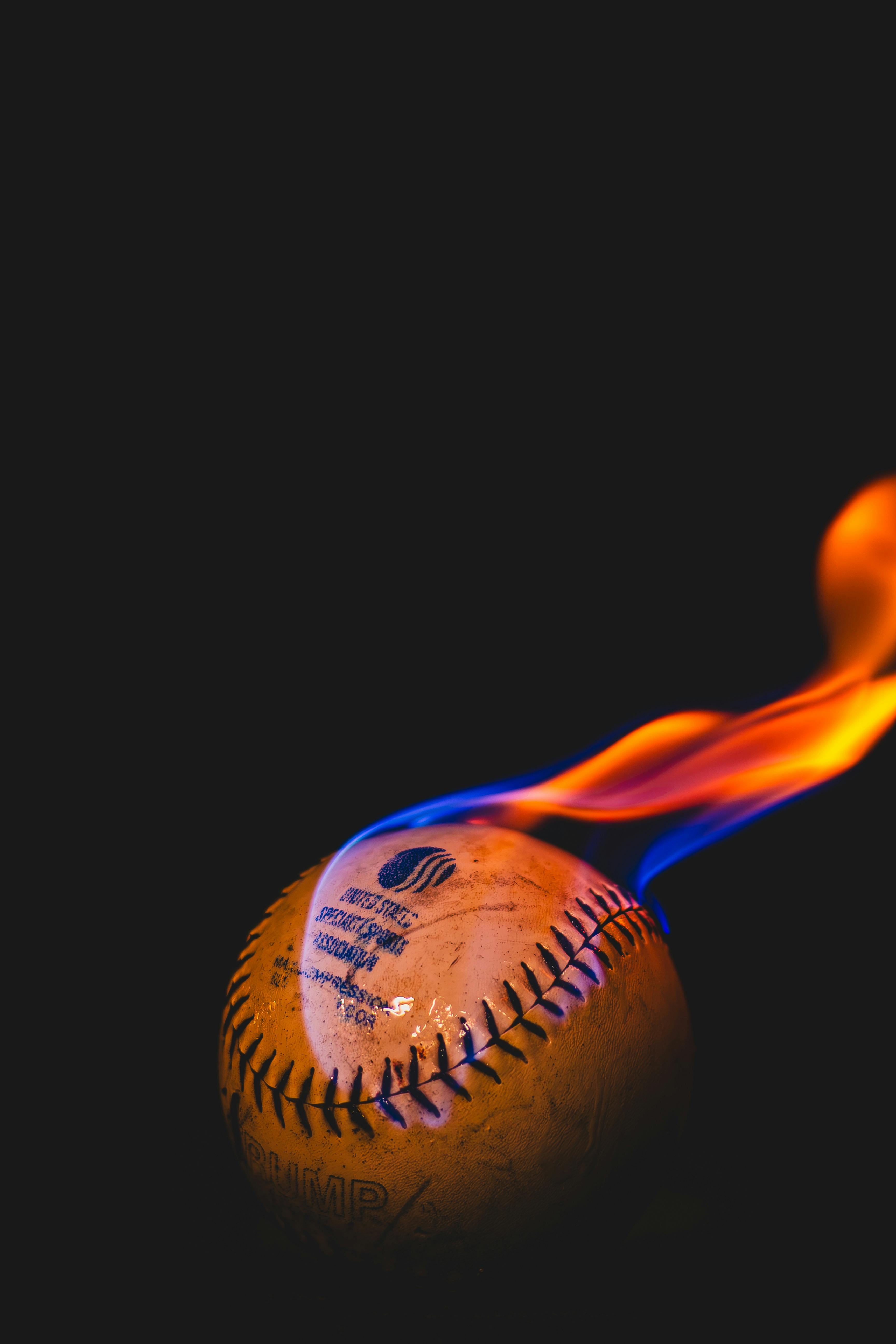 A baseball with flames on it · Free Stock Photo