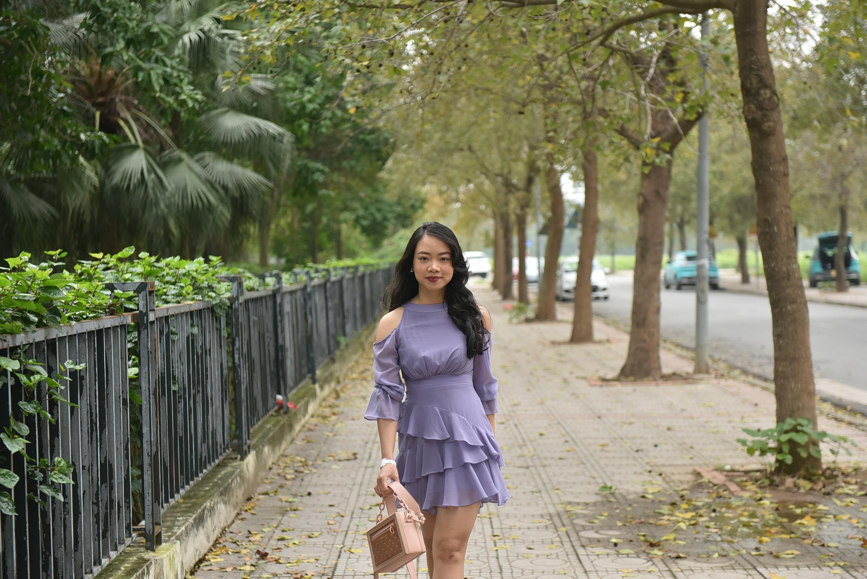Woman in Purple Dress Walking with Bag · Free Stock Photo