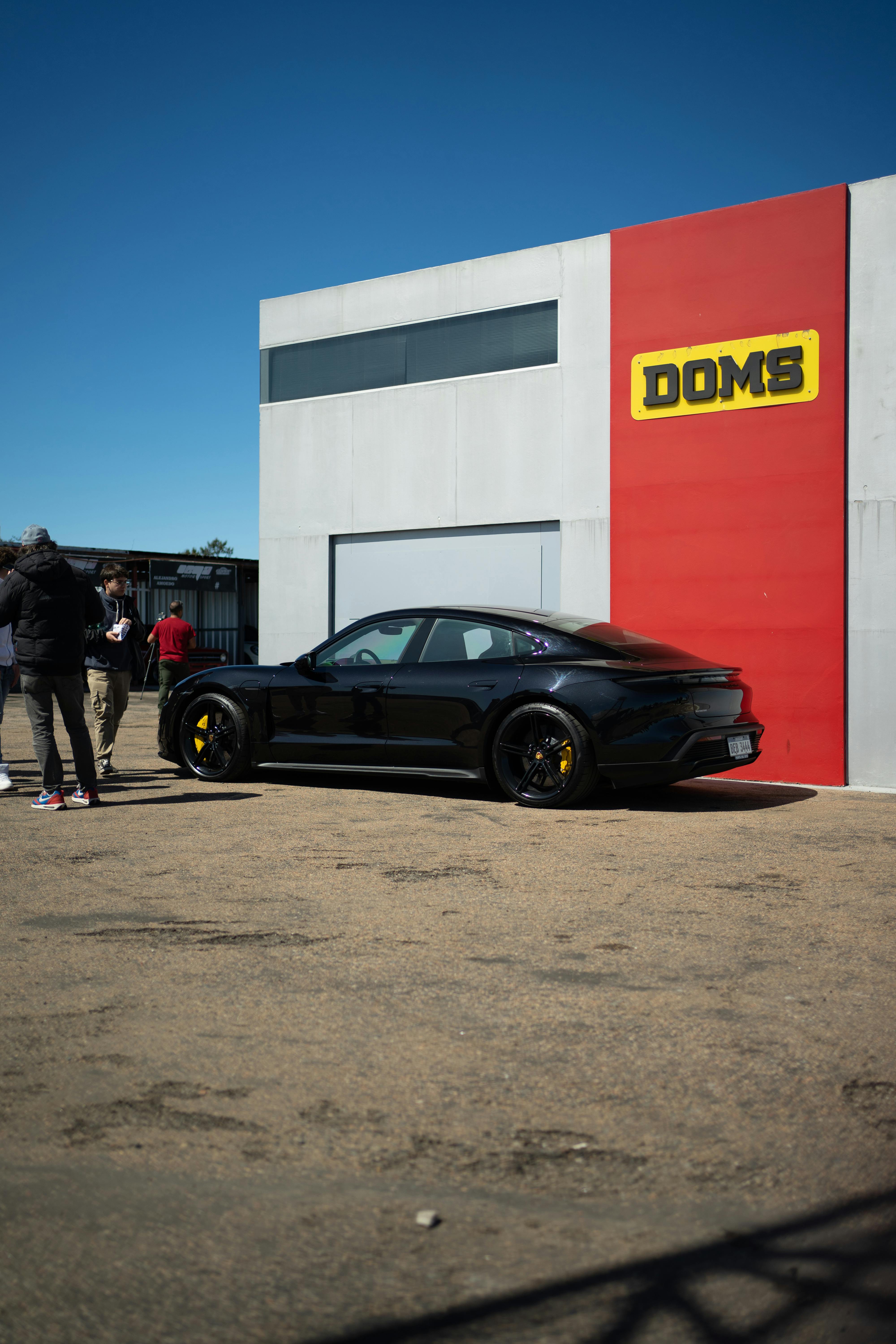 Black Sports Car near Building · Free Stock Photo