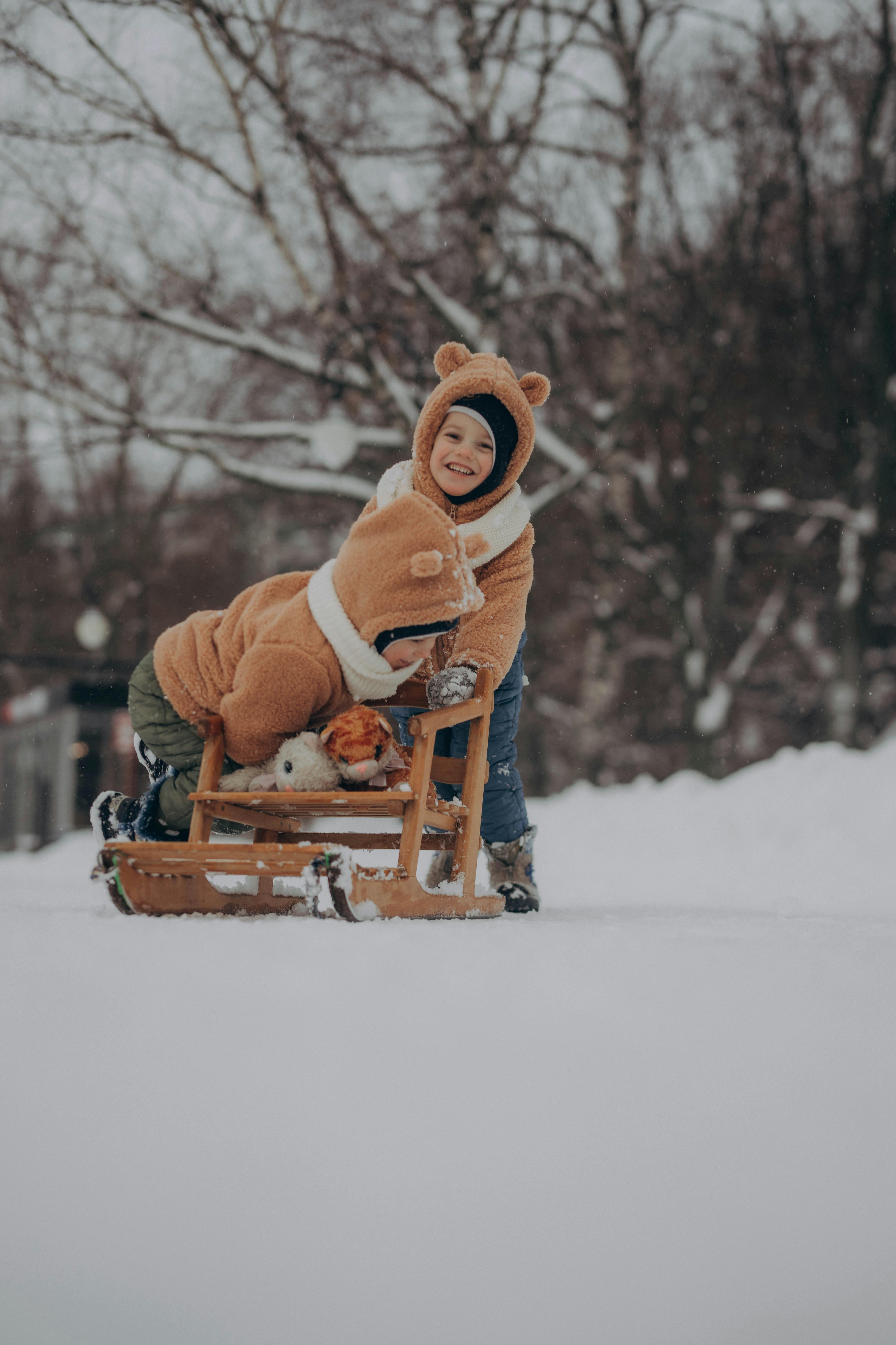 Boy on Sled in Winter · Free Stock Photo