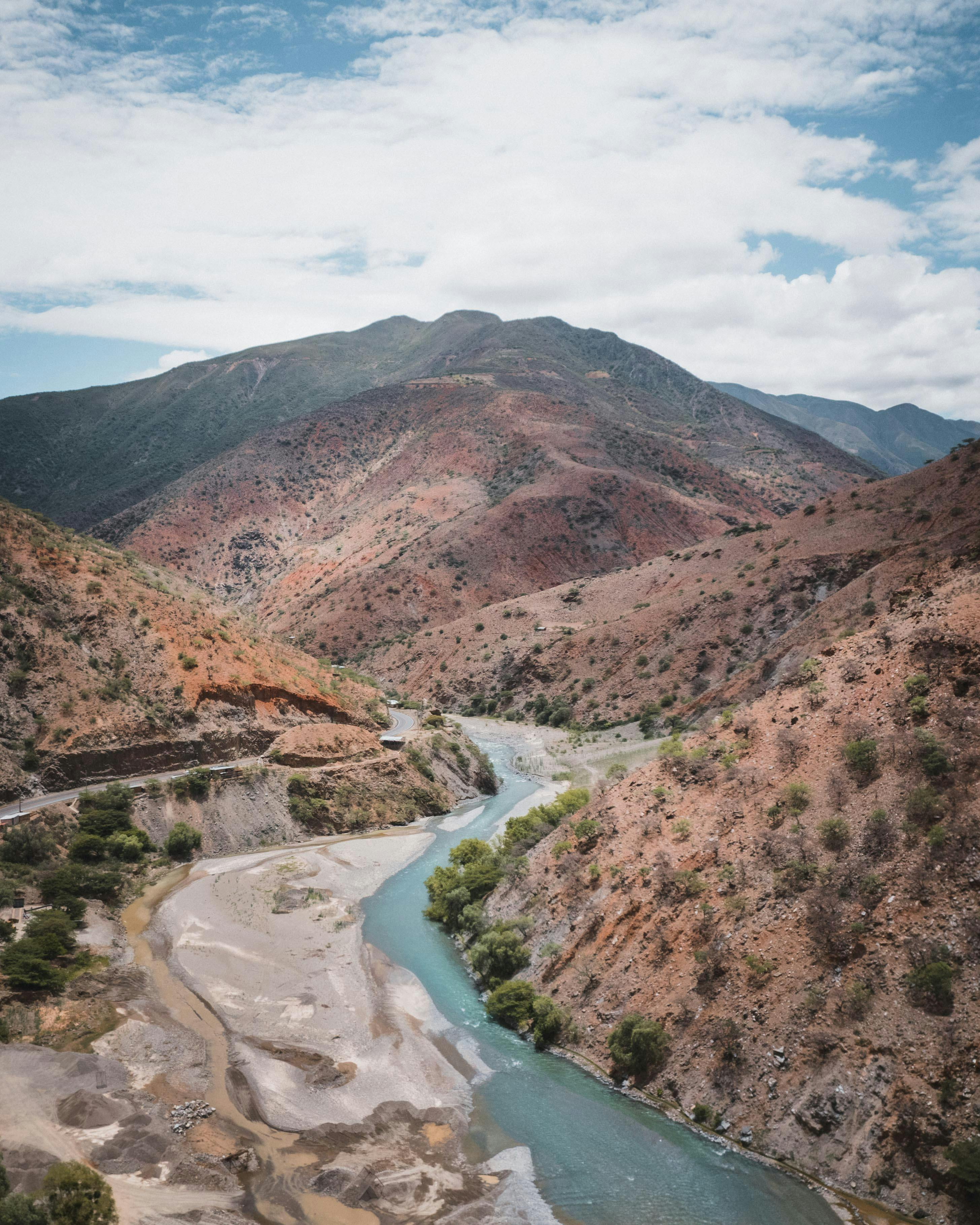 Water Stream Going Through a Valley · Free Stock Photo