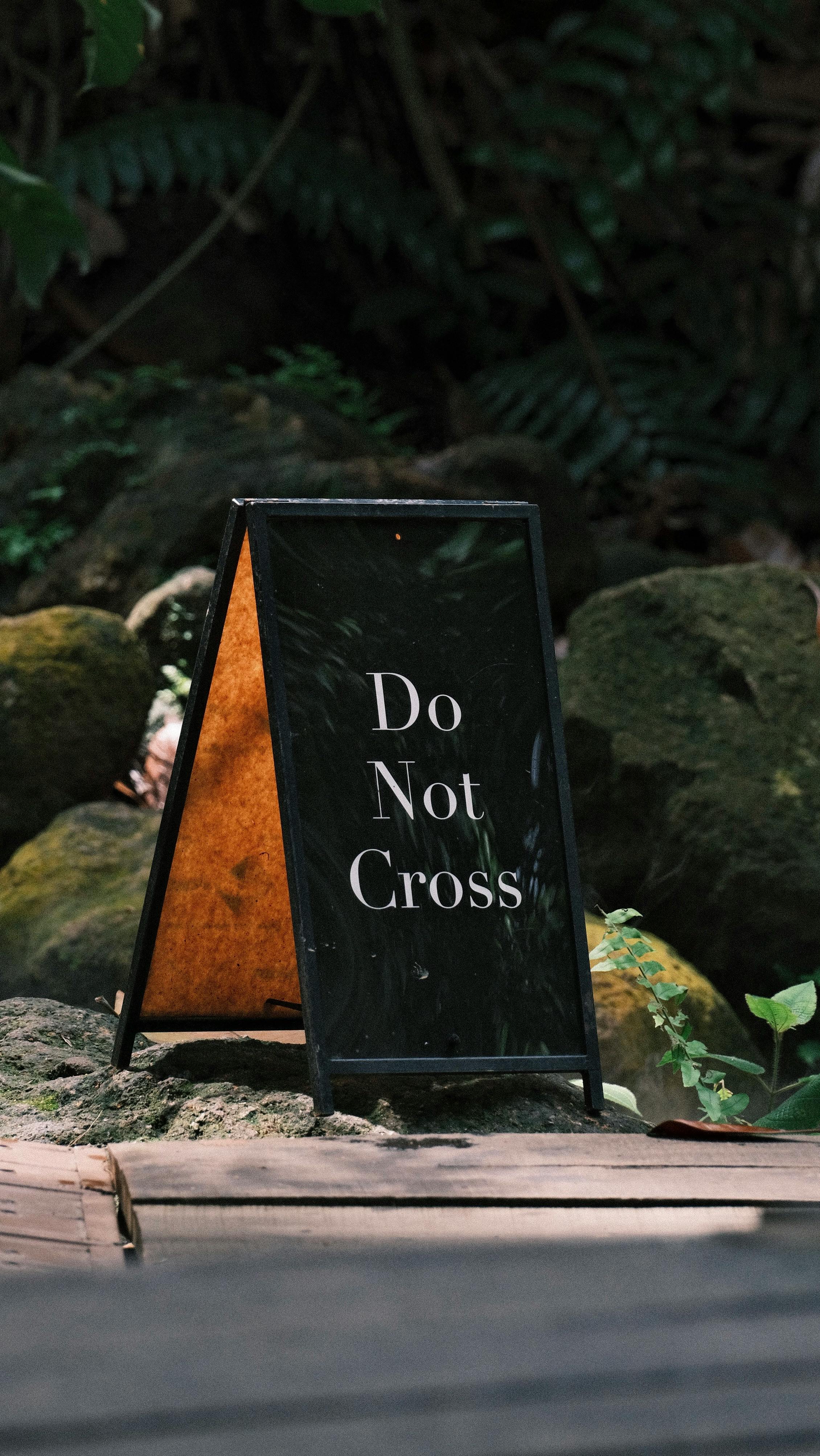 Do Not Cross Sign Standing Outdoors · Free Stock Photo