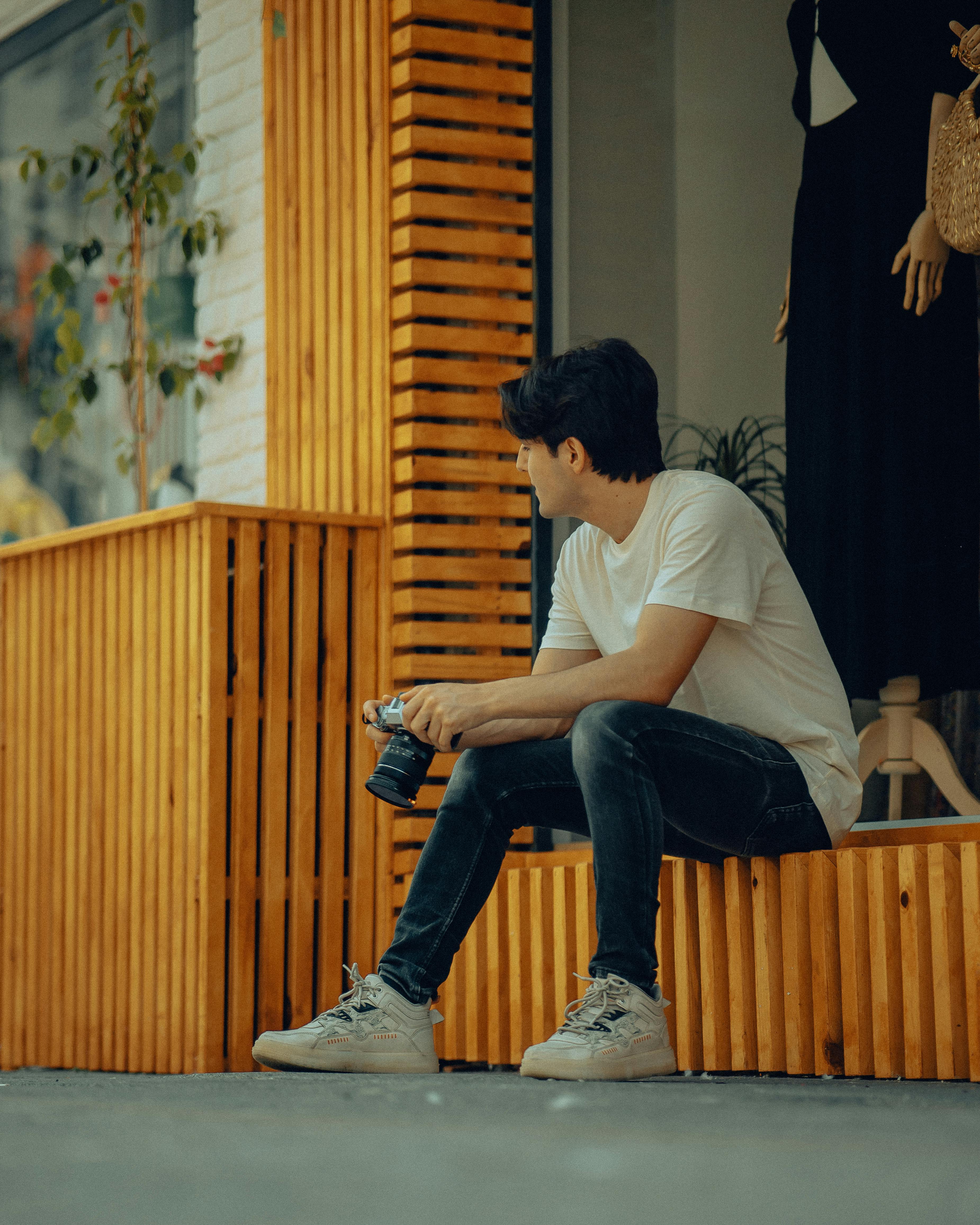 Man Sitting with Camera · Free Stock Photo