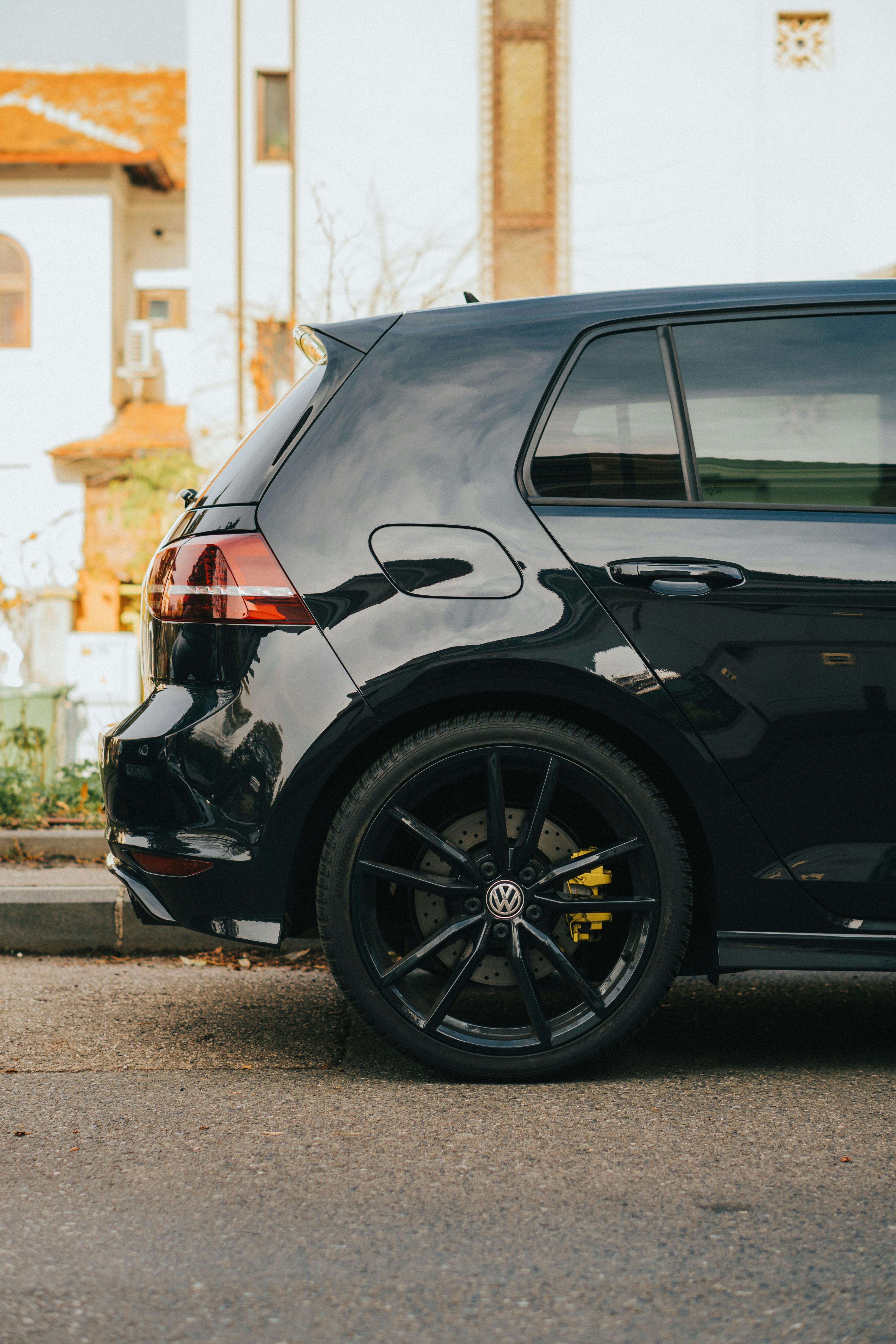 Black Car with Black Alloy Wheel and Yellow Break · Free Stock Photo