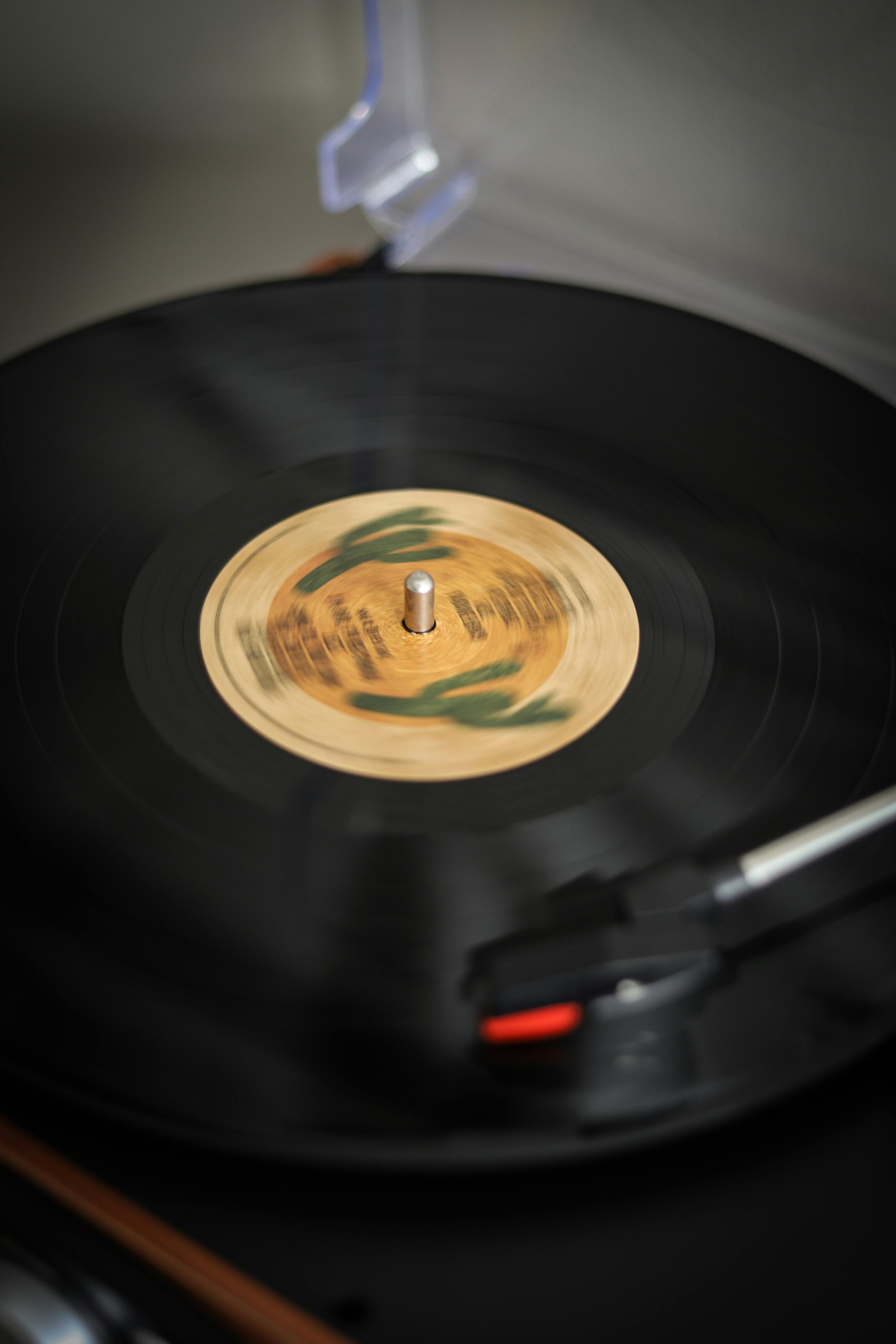 Classic Vinyl Record Spinning on Turntable · Free Stock Photo