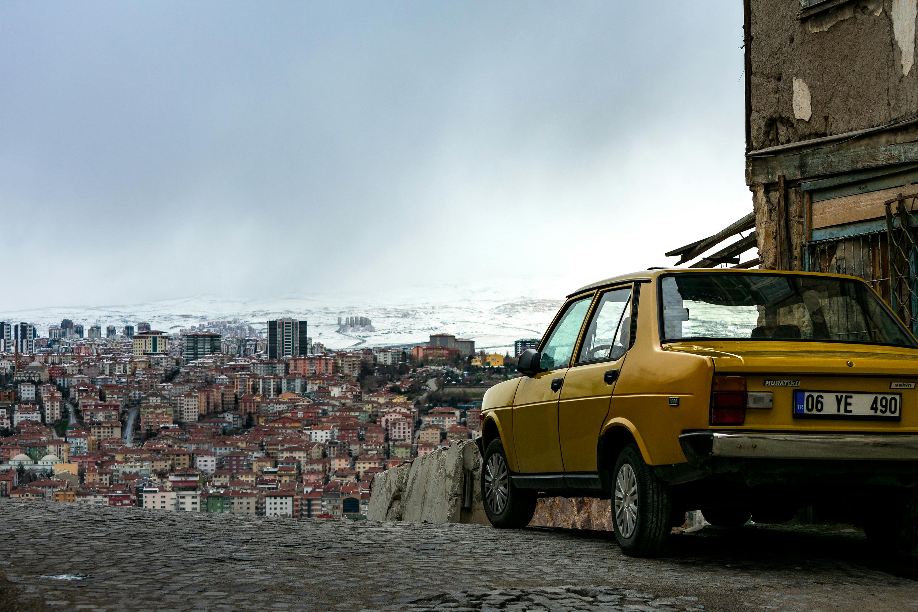 Yellow Car on City Hill · Free Stock Photo