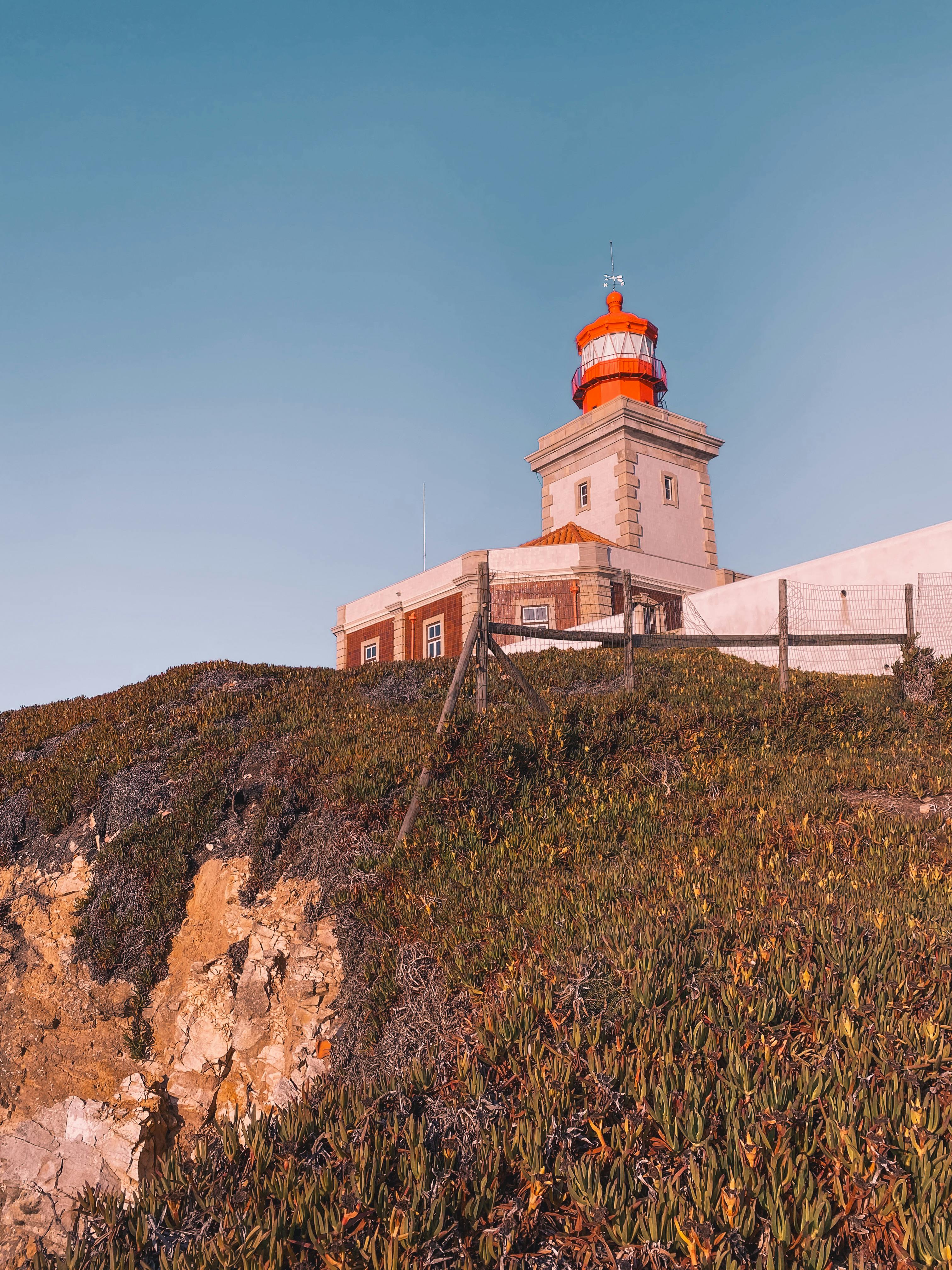 Lighthouse on a Hill in Sunlight · Free Stock Photo
