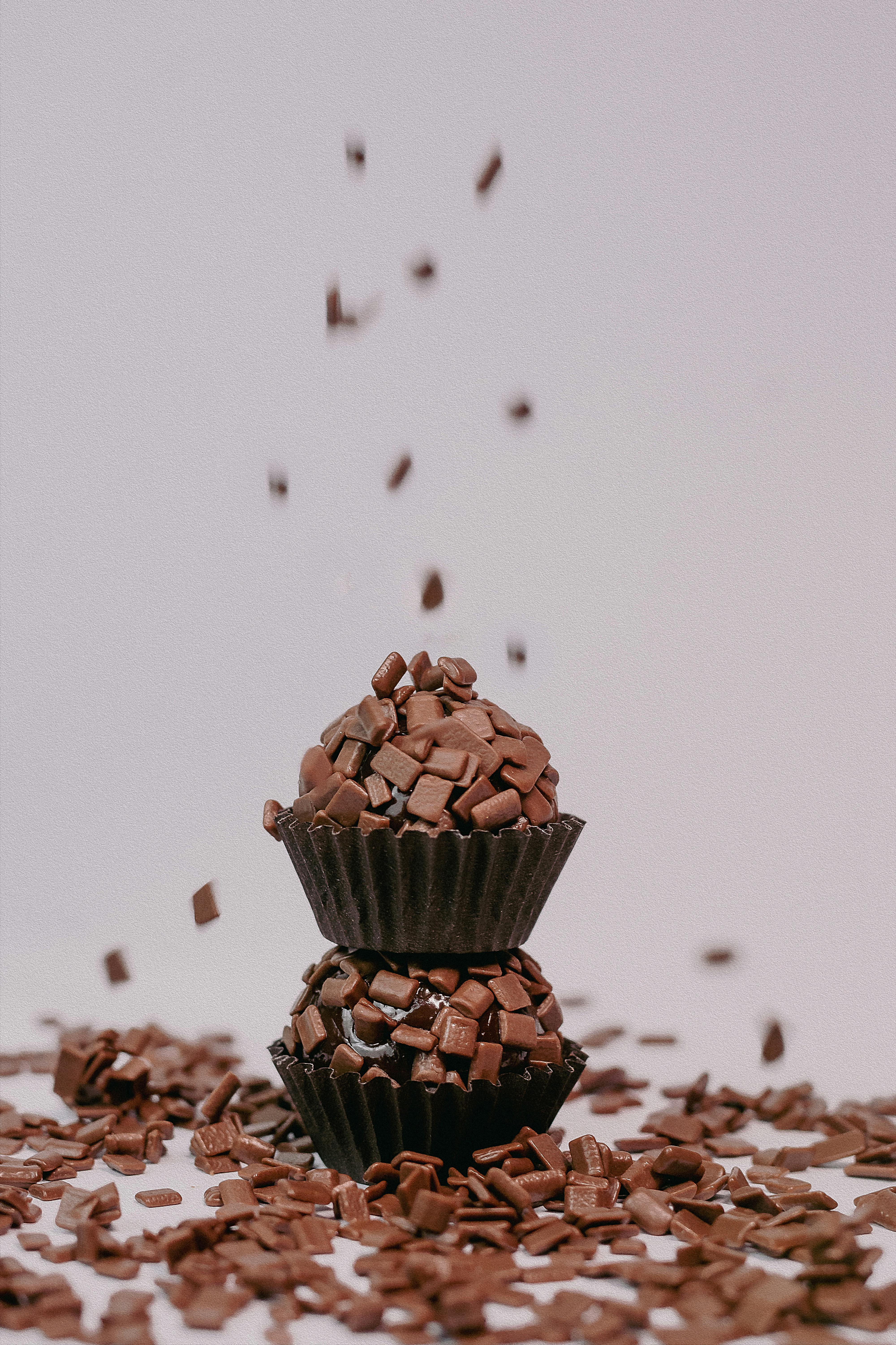 Cupcakes and Falling Chocolate Sprinkles · Free Stock Photo