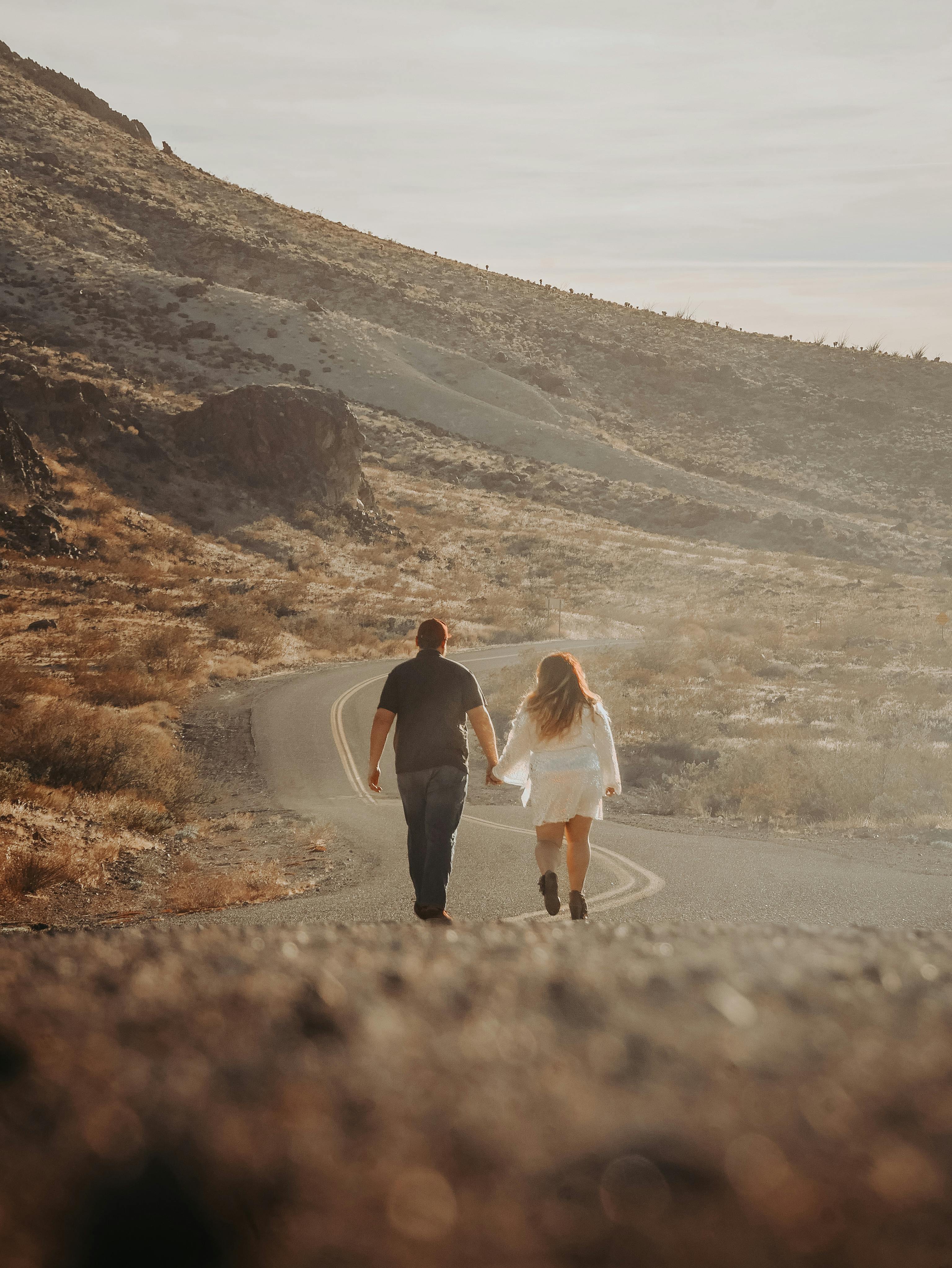 Holding Hands Couple Walking Road · Free Stock Photo