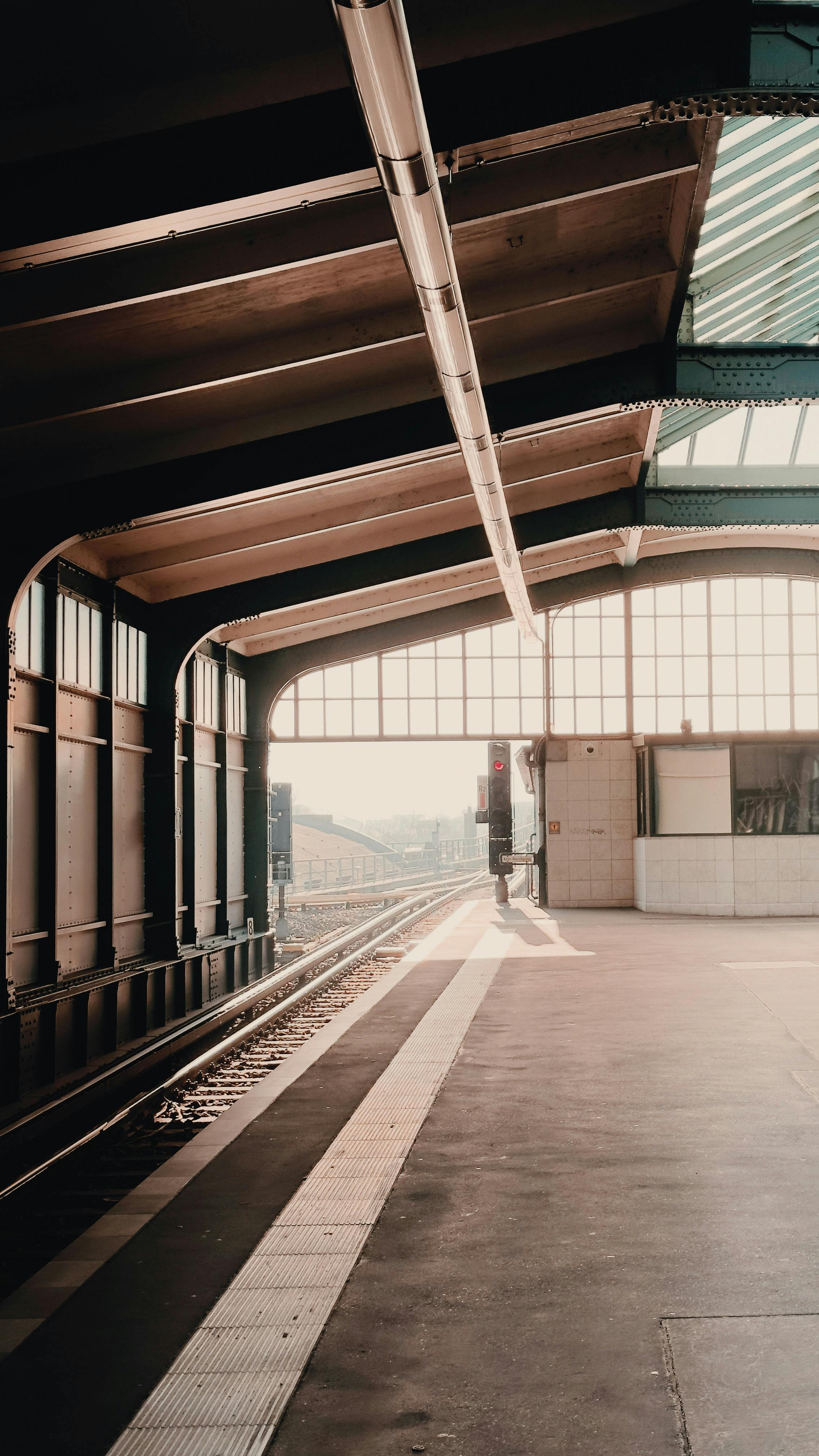 A train station with a long hallway and a window · Free Stock Photo
