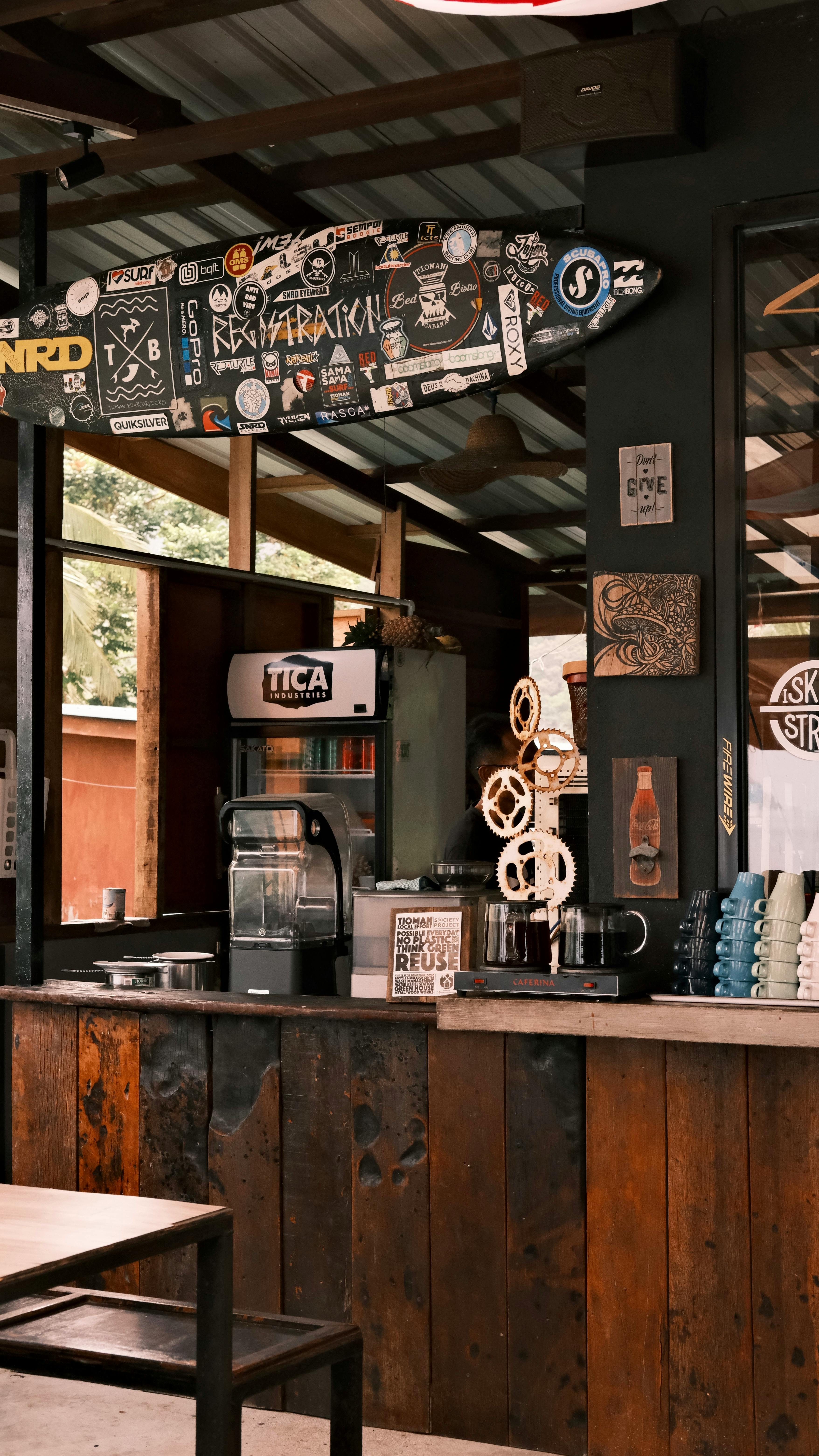 Surfboard over Wooden Counter in Bar · Free Stock Photo