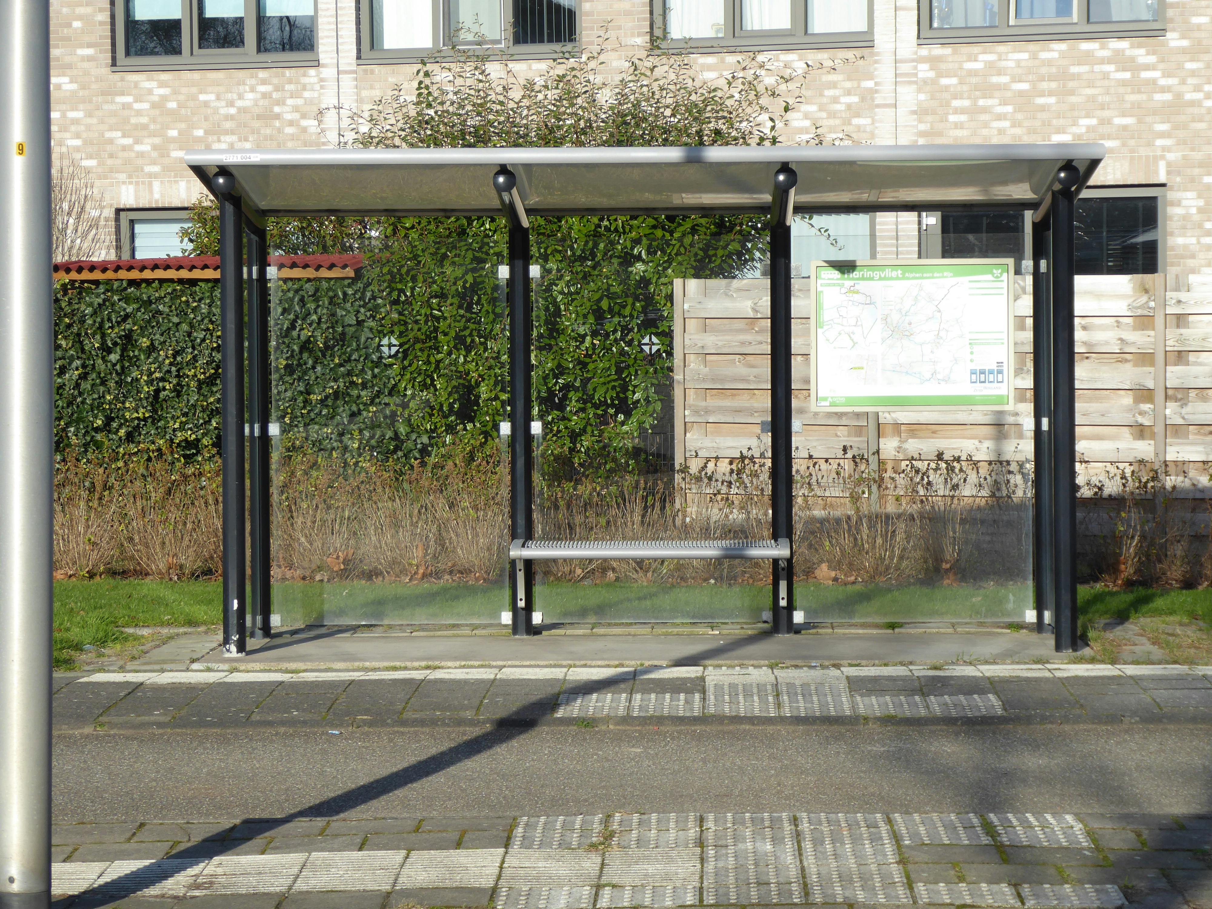 Bus Stop by Residential Building · Free Stock Photo