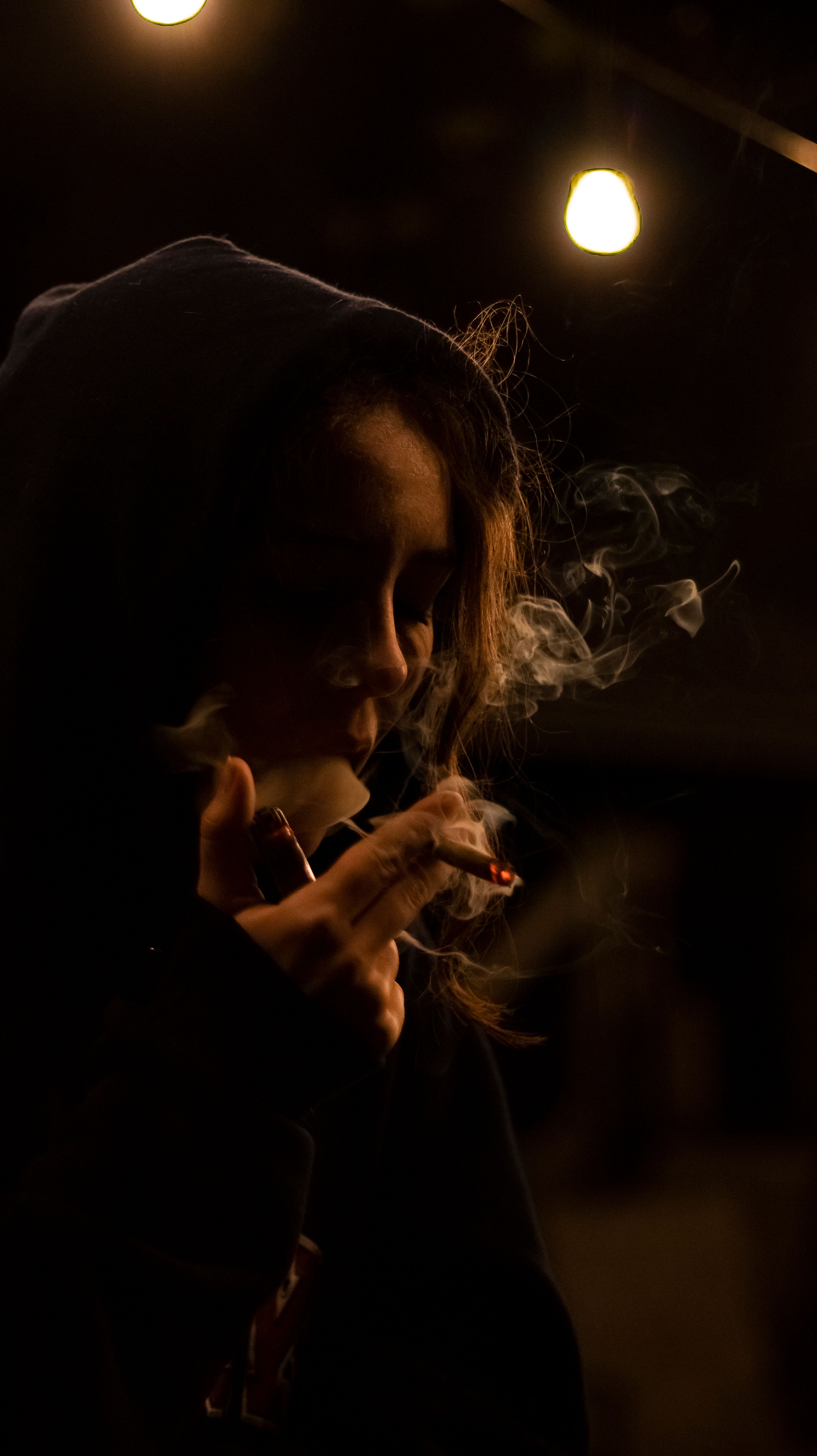 Woman Smoking Cigarette at Night · Free Stock Photo