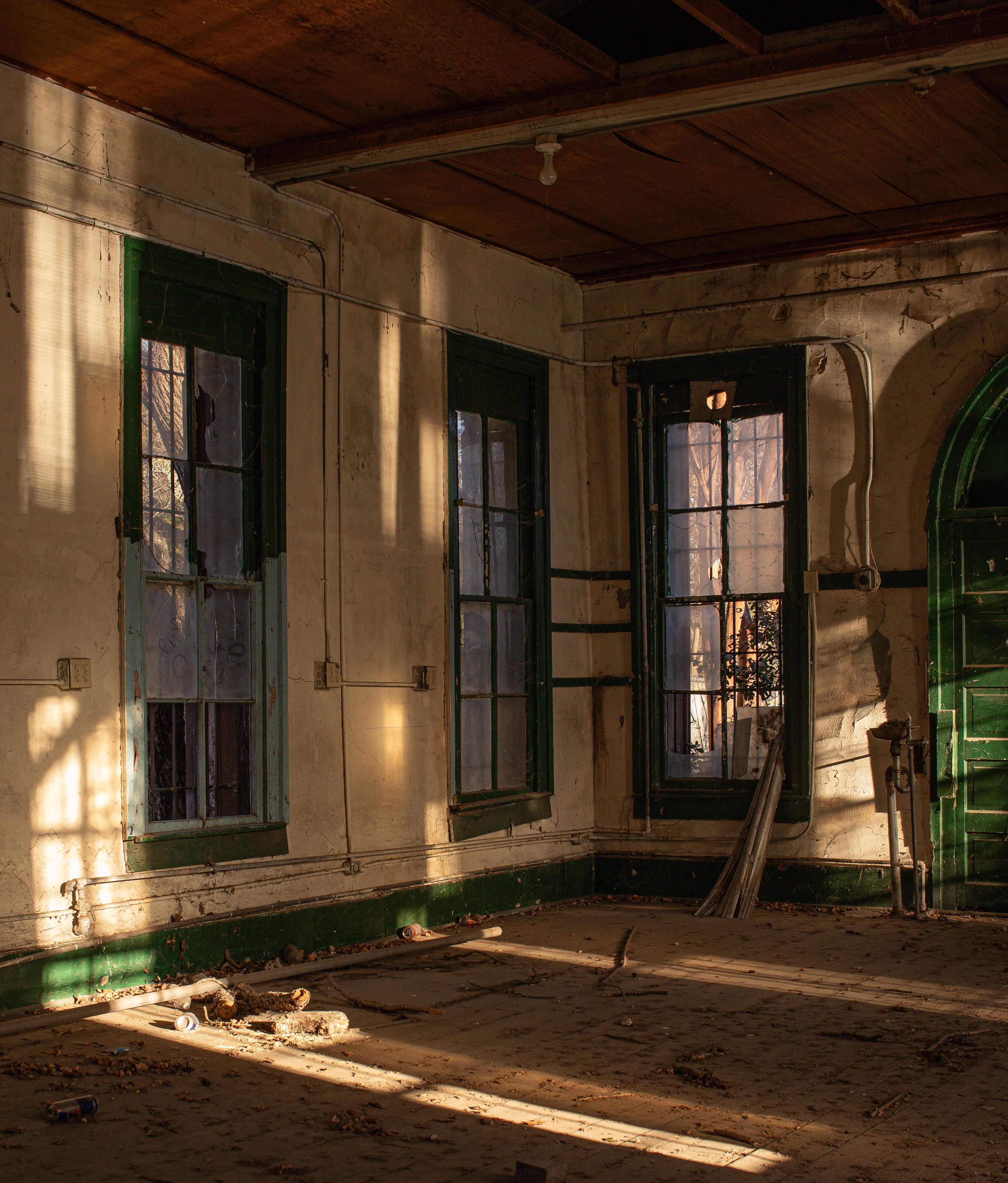 Sunlit in Decrepit Abandoned Room · Free Stock Photo