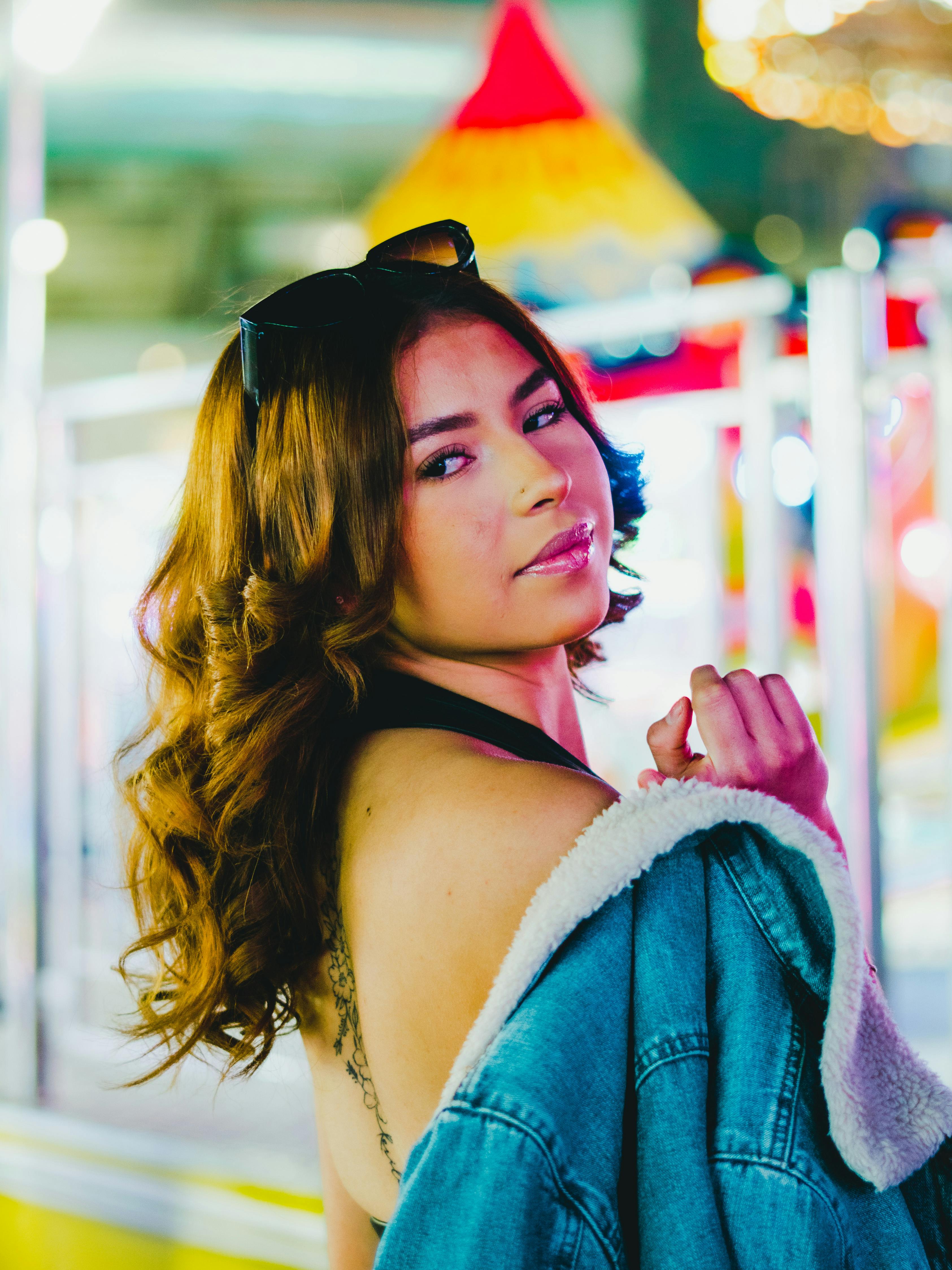 Woman Holds Fur Denim Jacket · Free Stock Photo