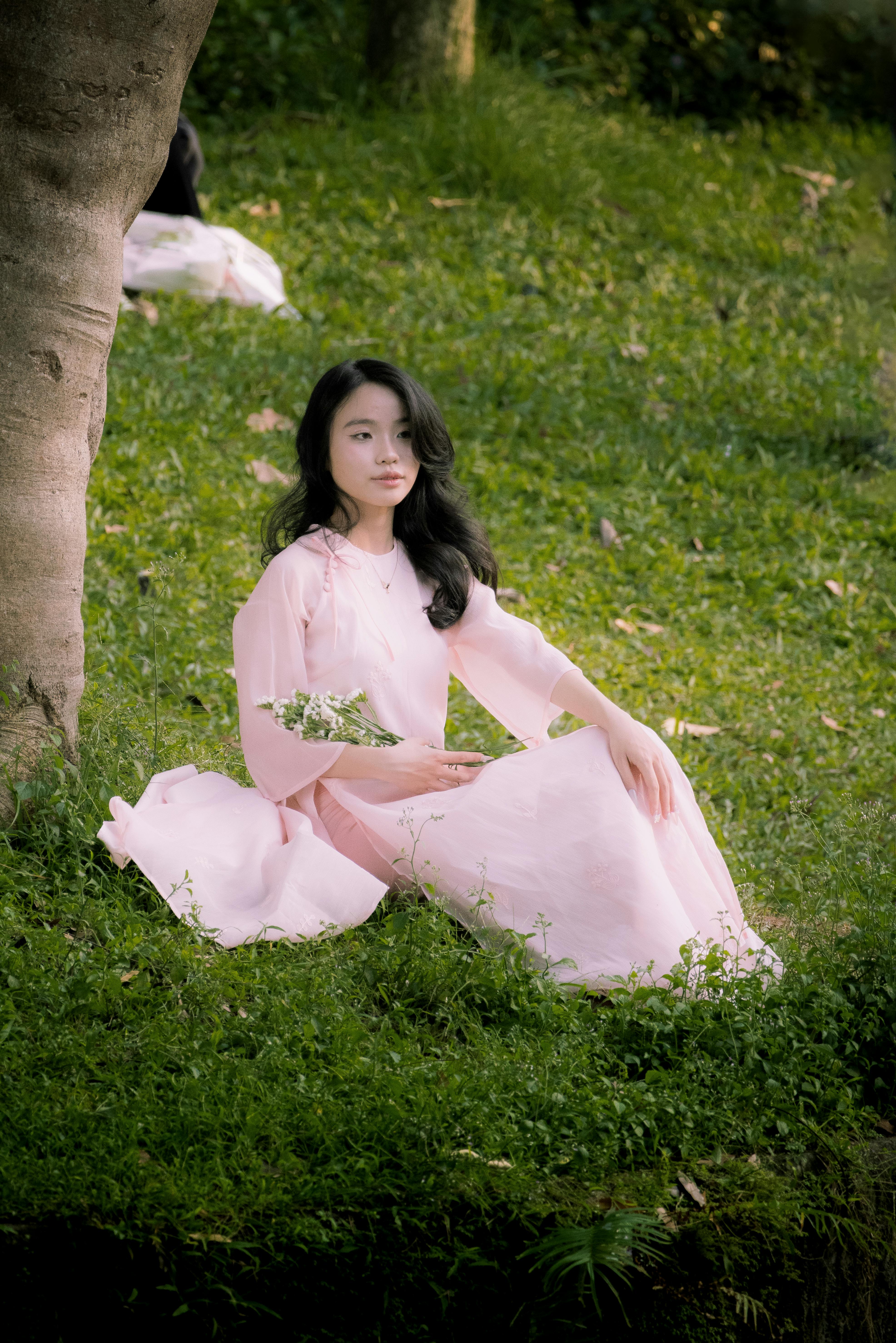 Woman in Pink Mandarin Gown on Grass · Free Stock Photo