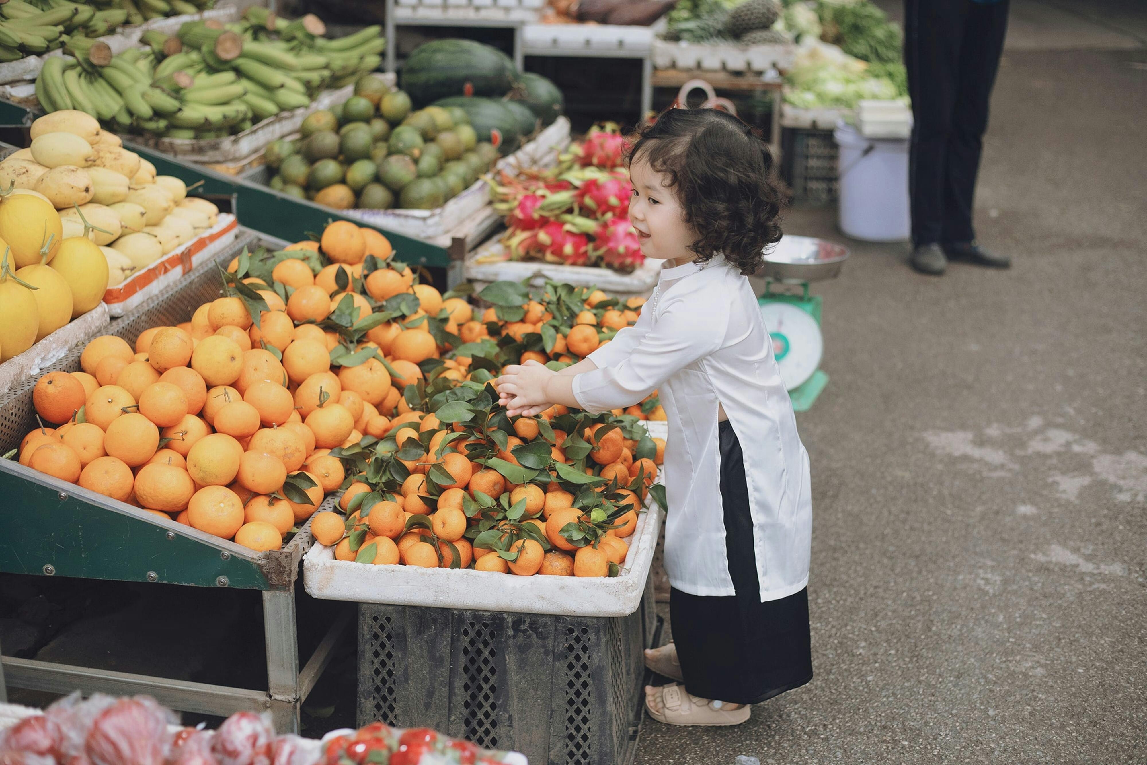 Girl in Traditional Clothing at Bazaar · Free Stock Photo