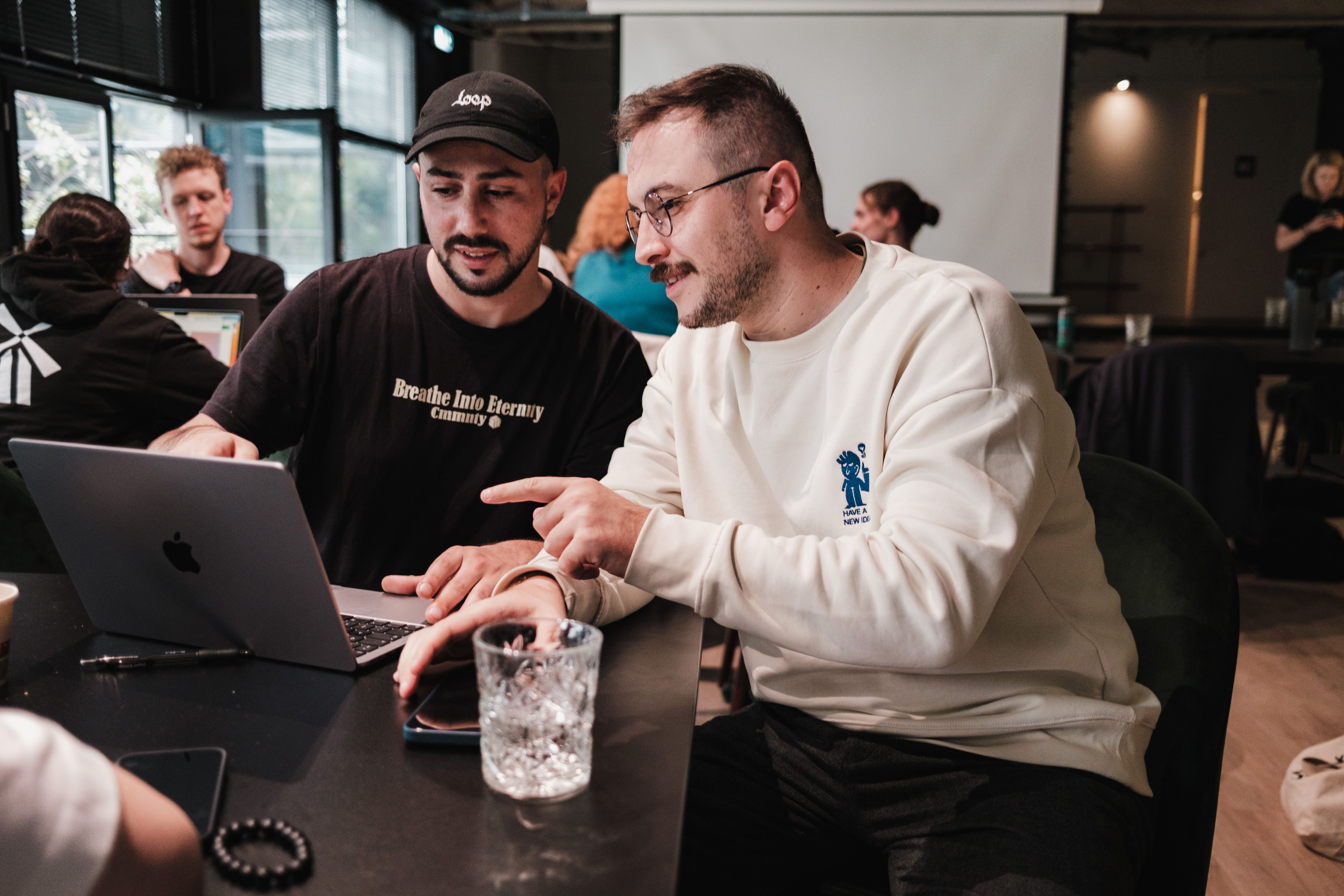 Smiling Men Working on Laptop · Free Stock Photo