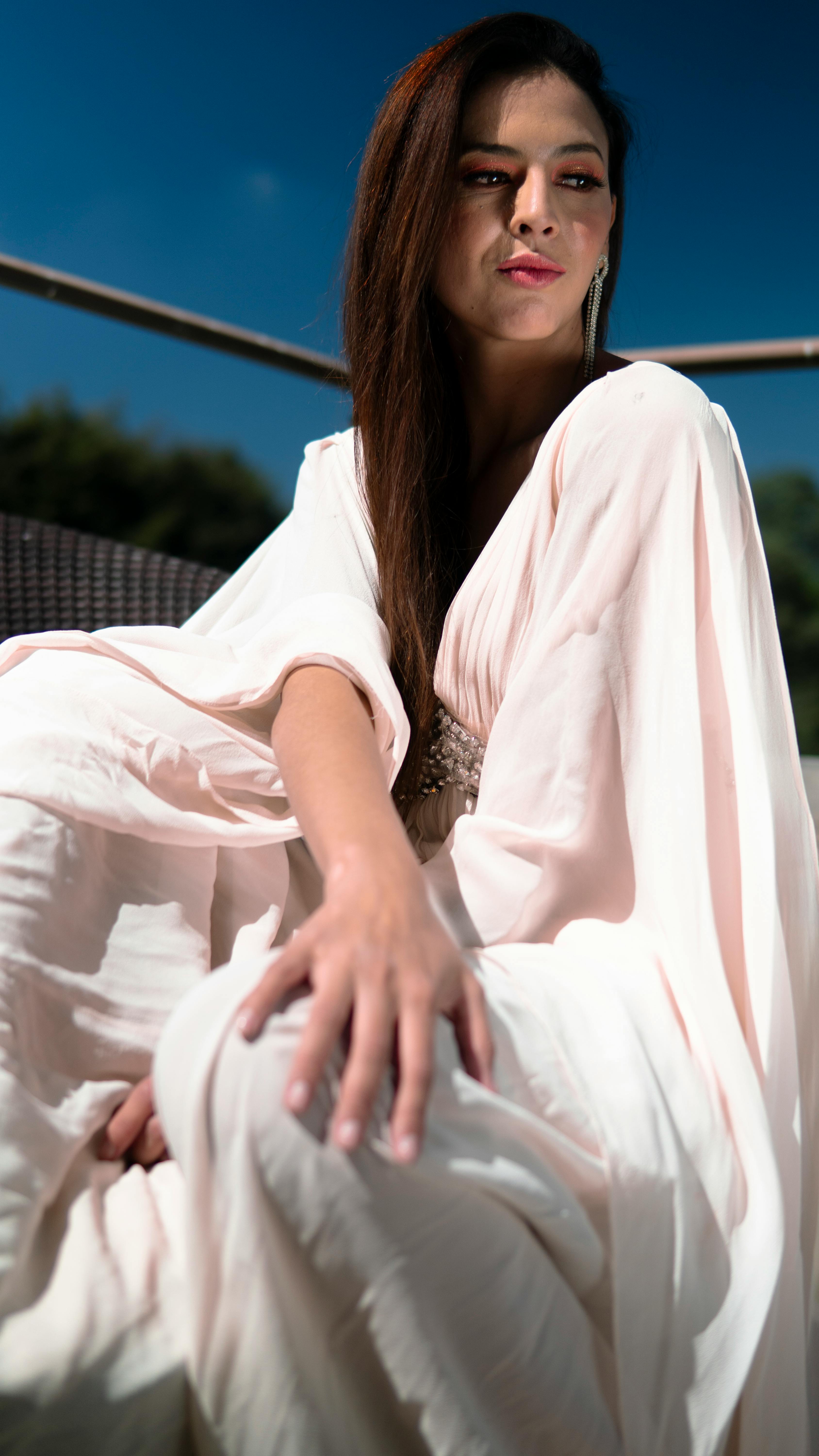 Gorgeous Brunette Woman in Peach Dress · Free Stock Photo