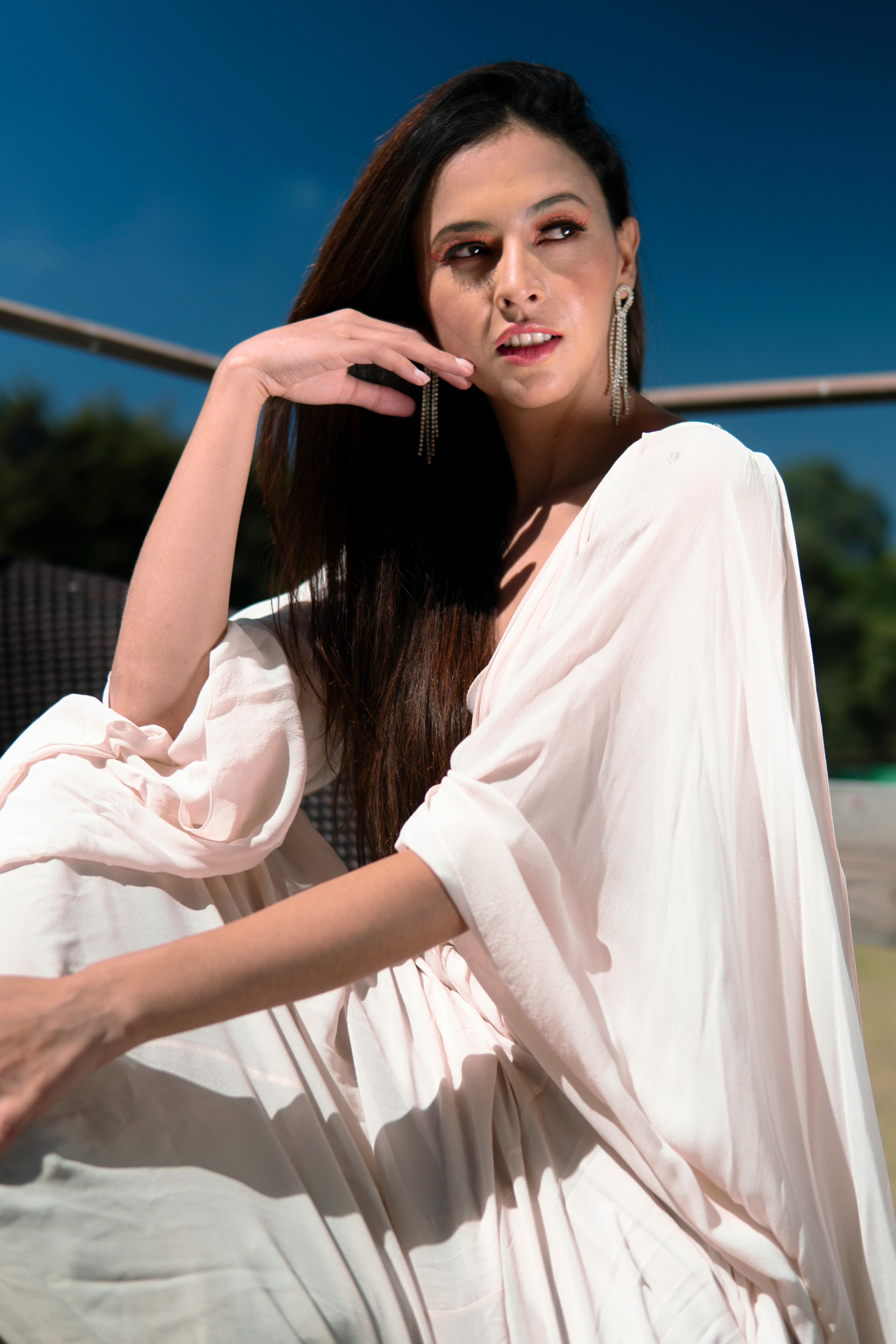 Beautiful Brunette Woman in Peach Dress · Free Stock Photo