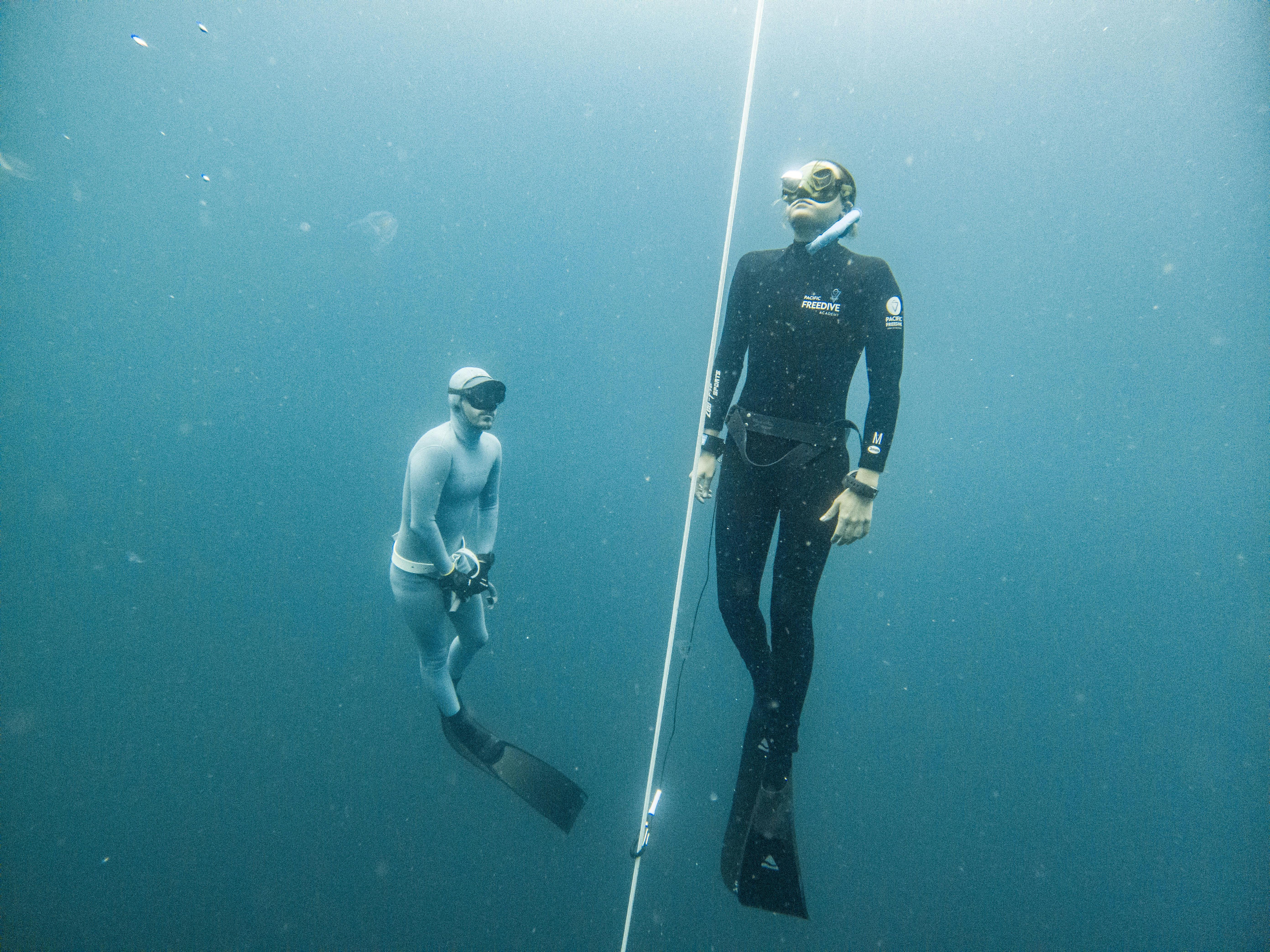 Breath-holding Diver Emerging Under the Supervision of Another ...