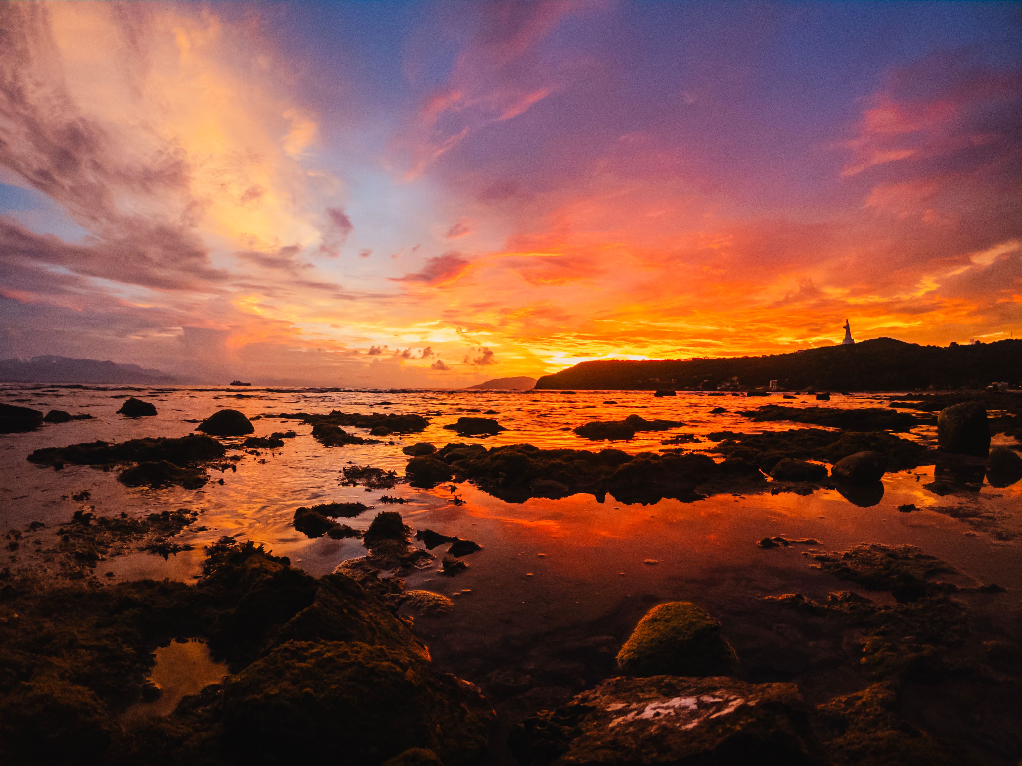 Brown and Gray Rocks on Seashore during Sunset · Free Stock Photo