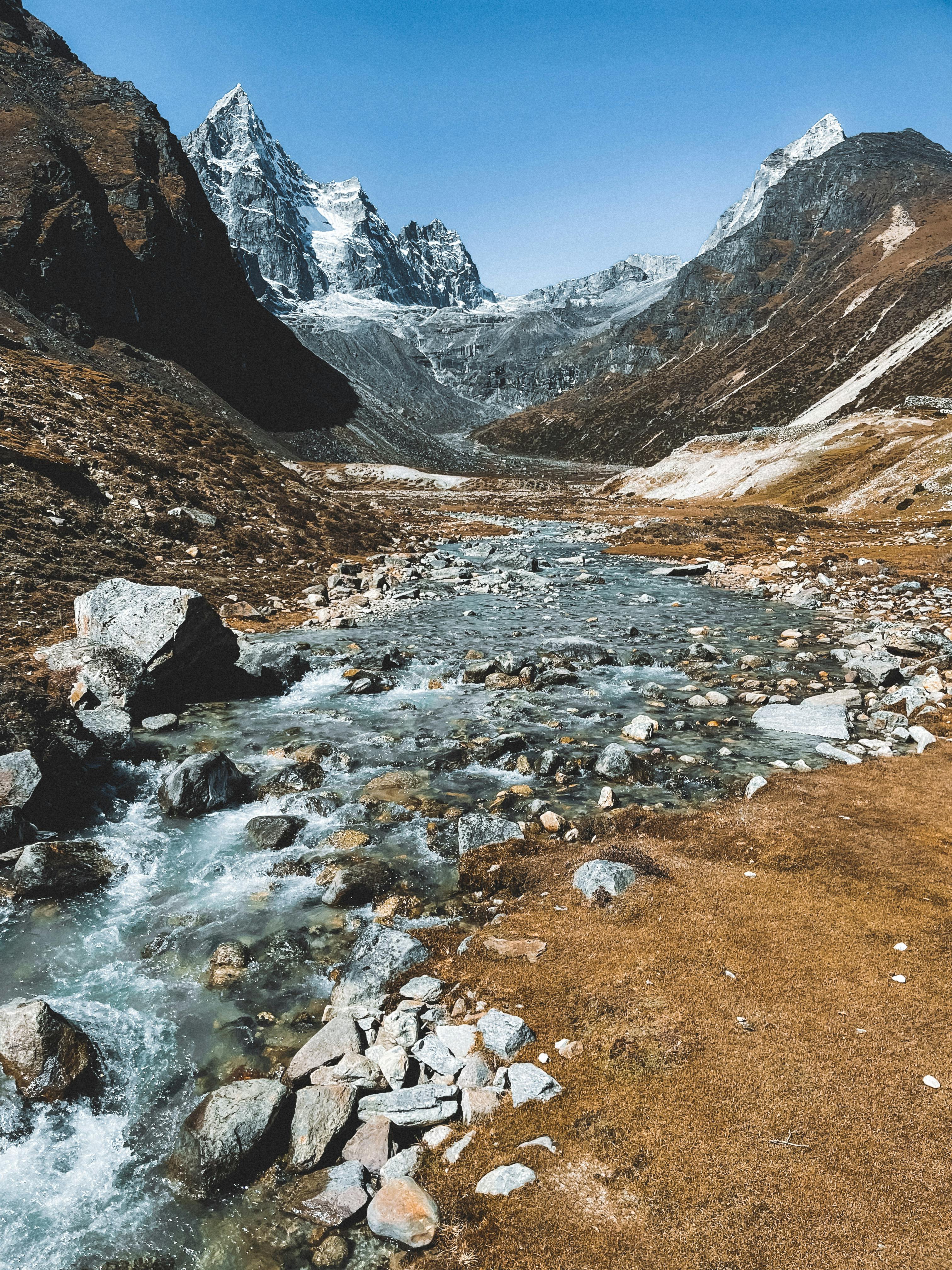 River Running through a Mountain Landscape · Free Stock Photo