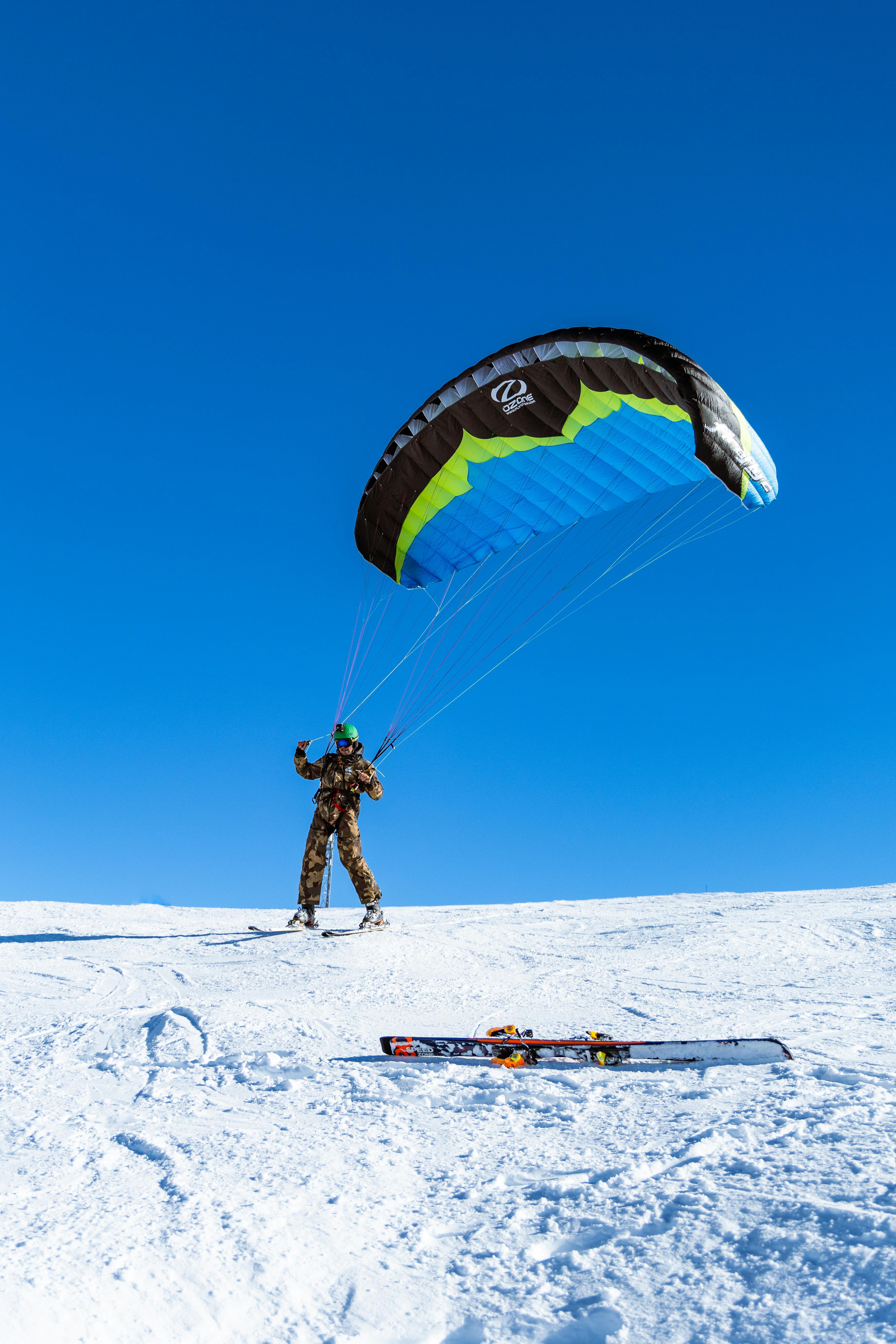 Person Skiing with Parachute in Winter · Free Stock Photo