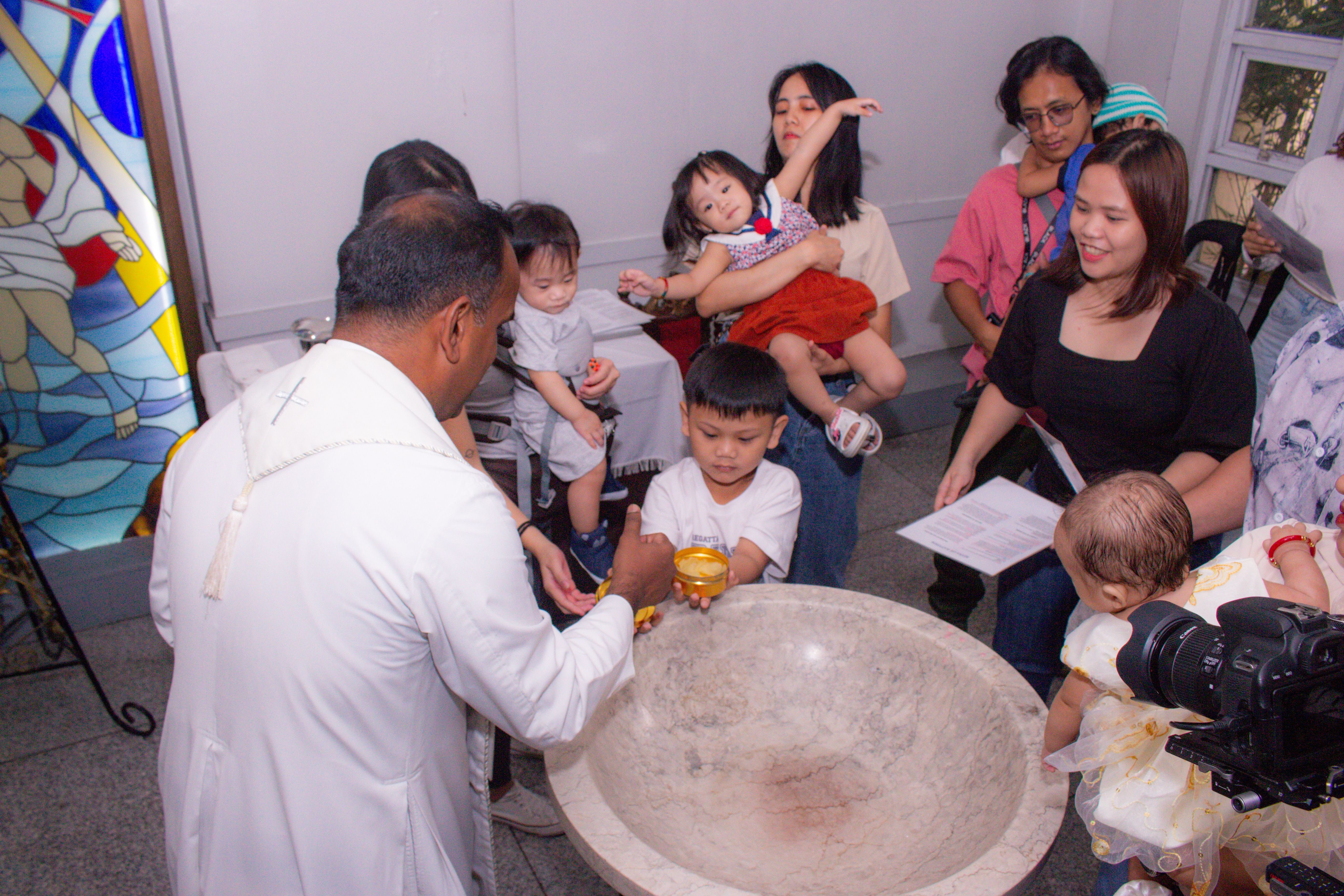 Women and Children Standing around Priest · Free Stock Photo