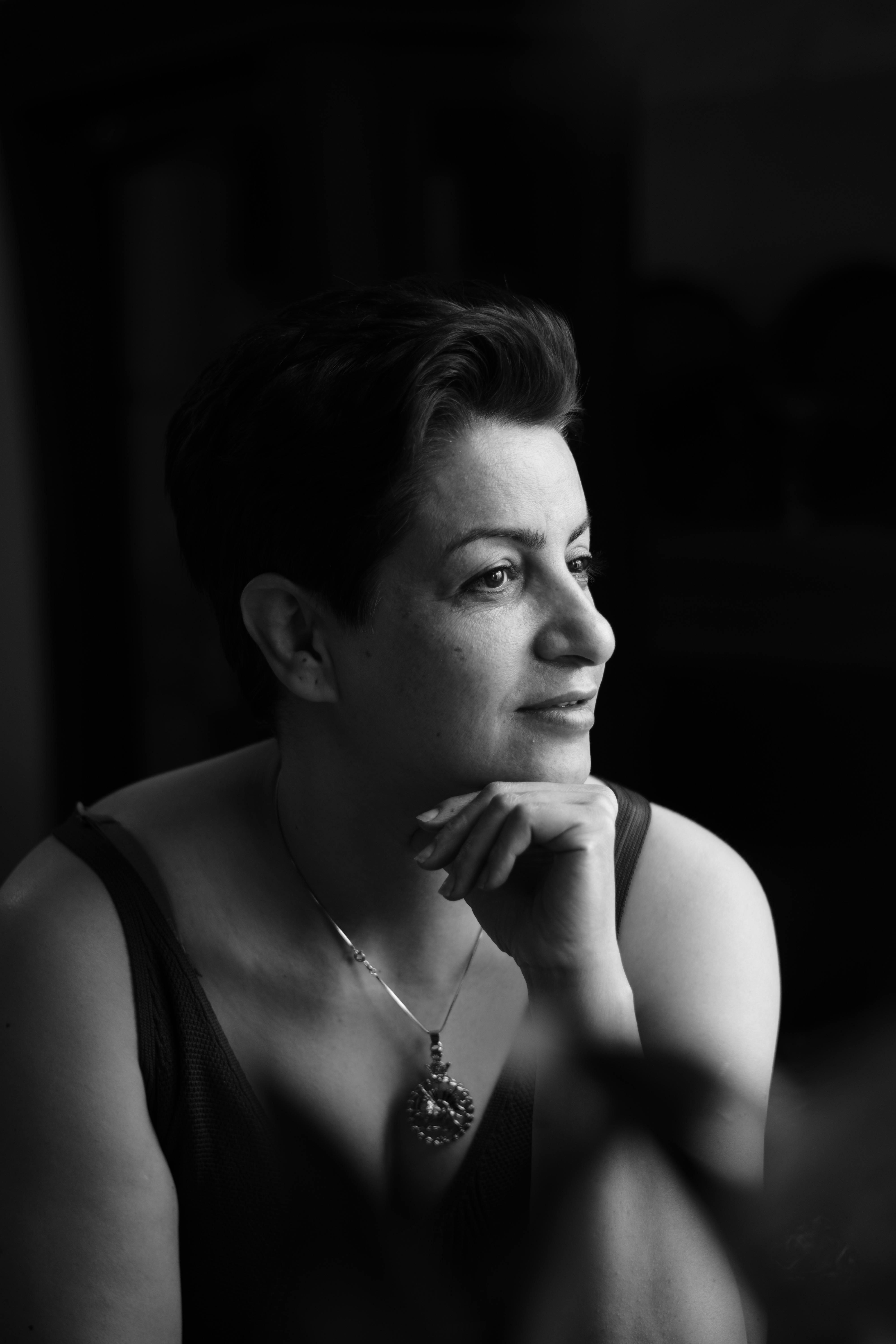 Woman with Hands under Chin in Blue Light · Free Stock Photo